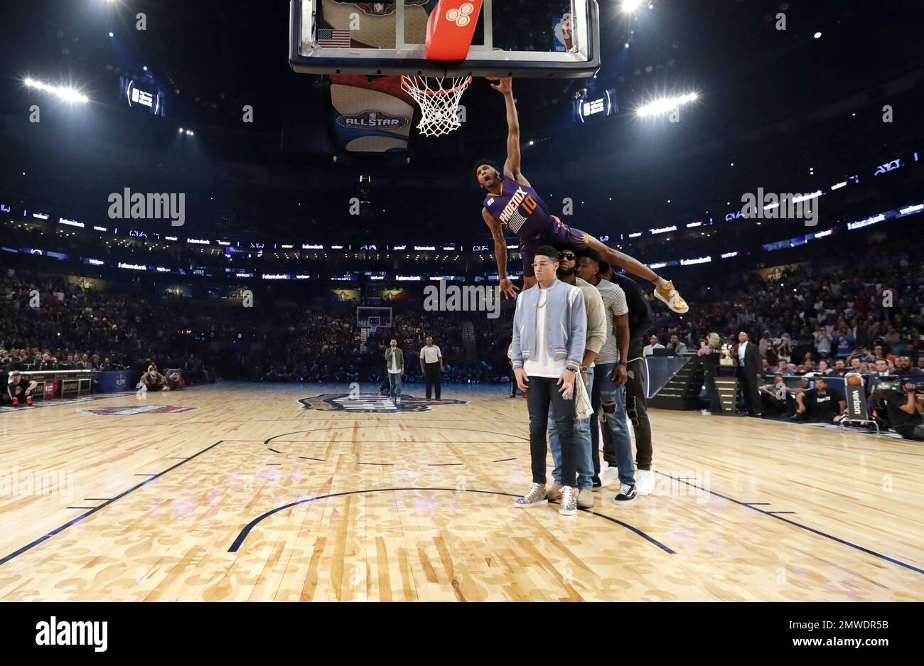 Phoenix Suns Derrick Jones, Jr. leaps over teammates while ...