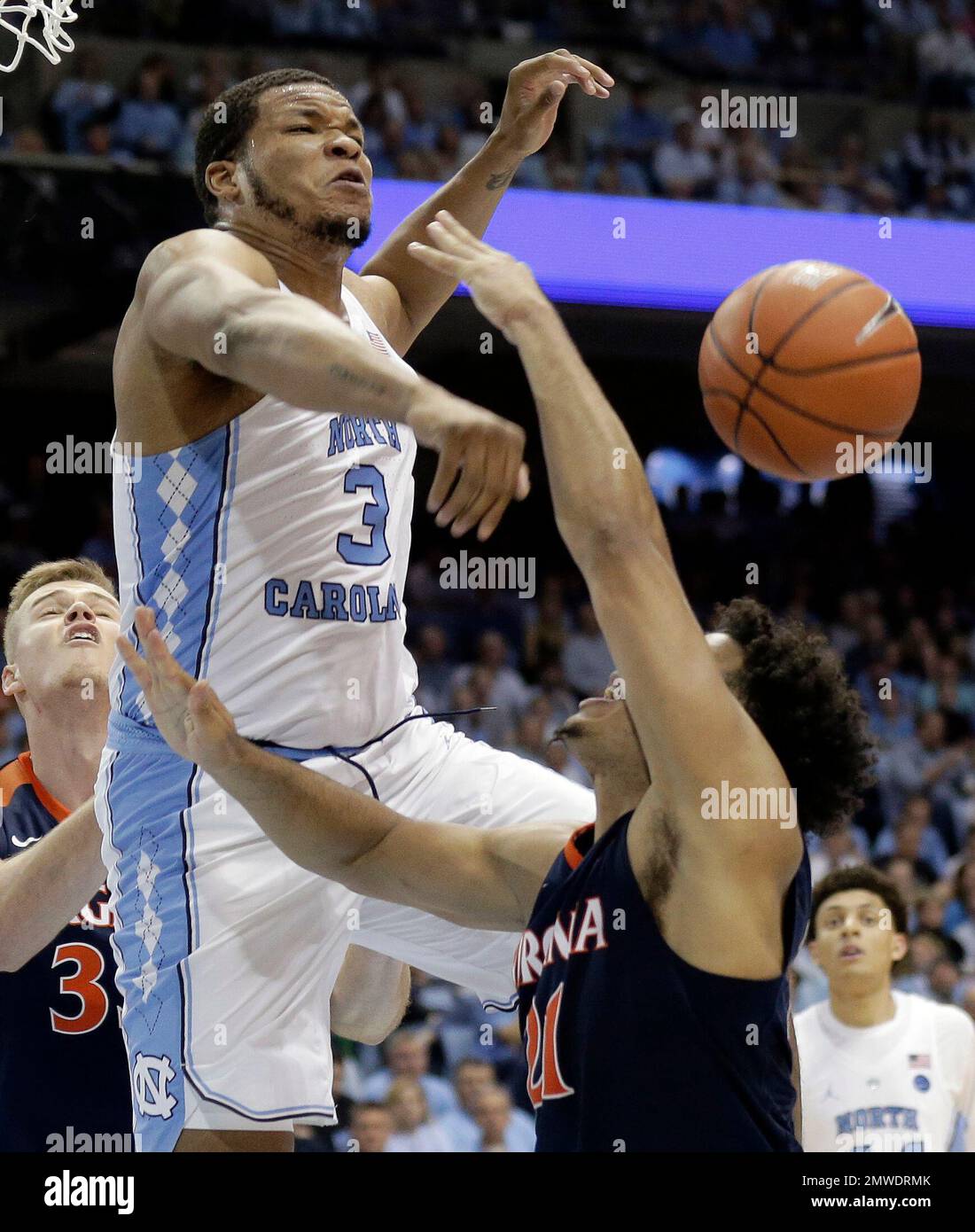 North Carolina's Kennedy Meeks (3) blocks a shot by Virginia's Isaiah ...