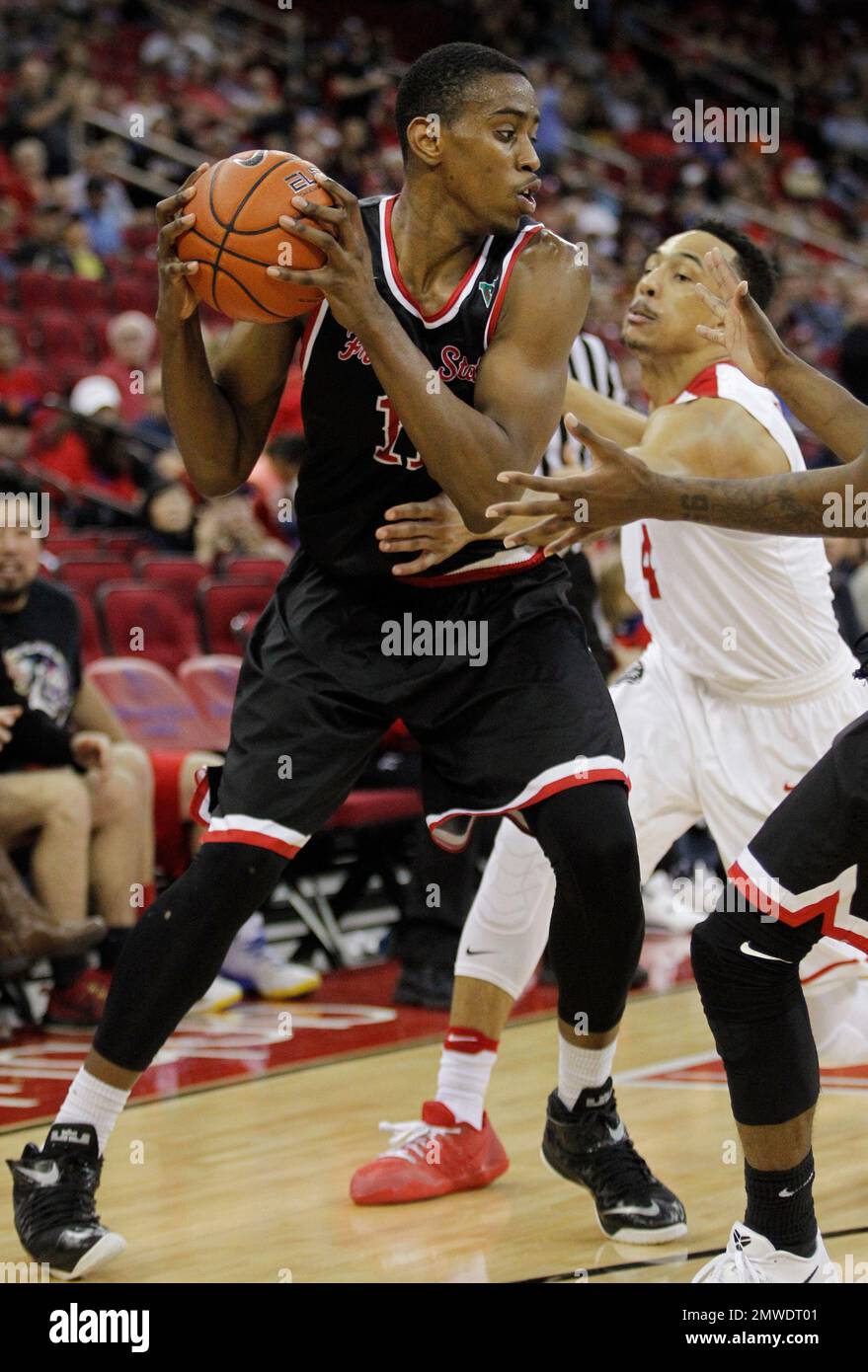 New Mexico's Elijah Brown tries to stop Fresno State's Bryson Williams ...
