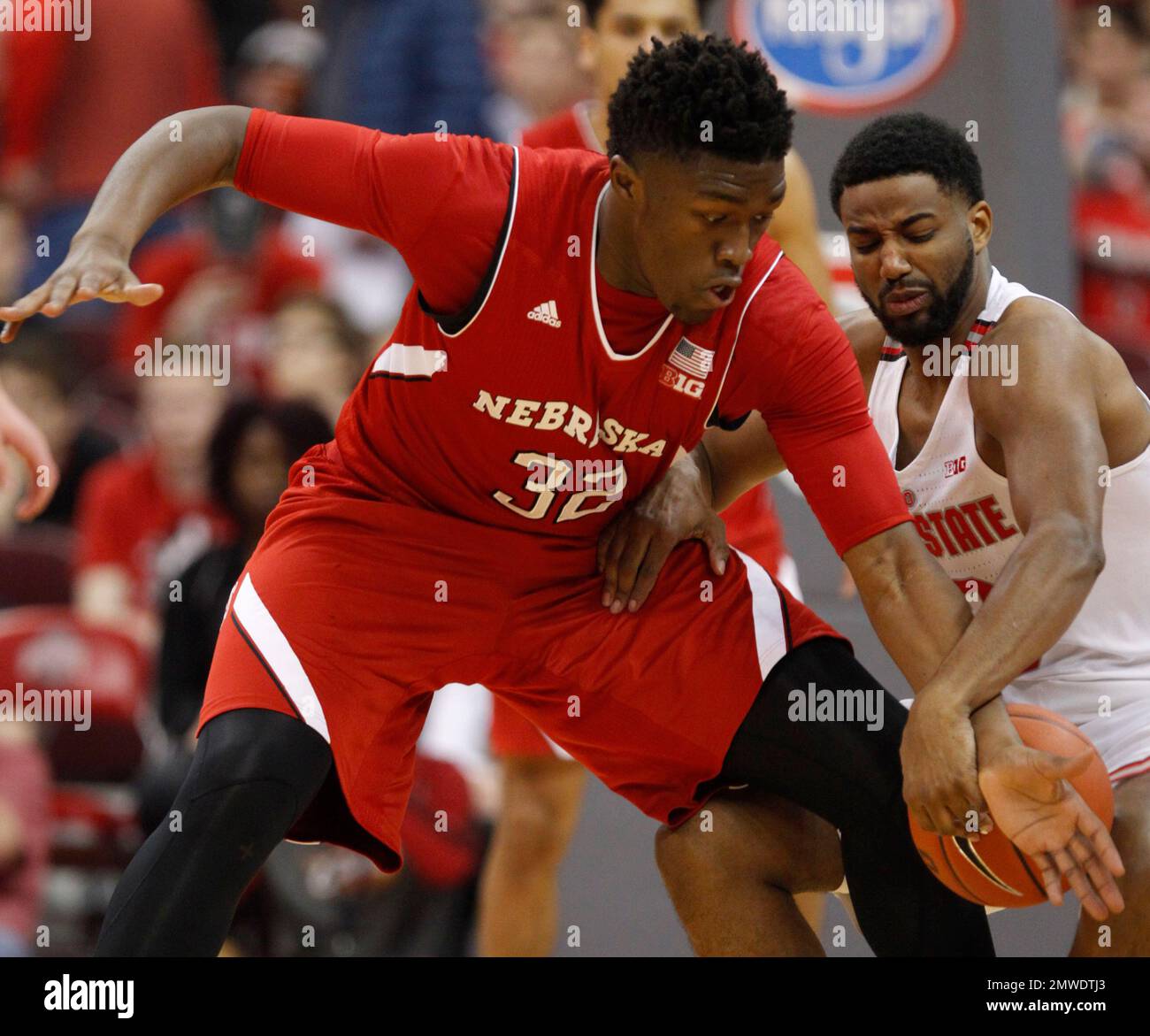 Nebraska center Jordy Tshimanga, left, works for a loose ball against ...