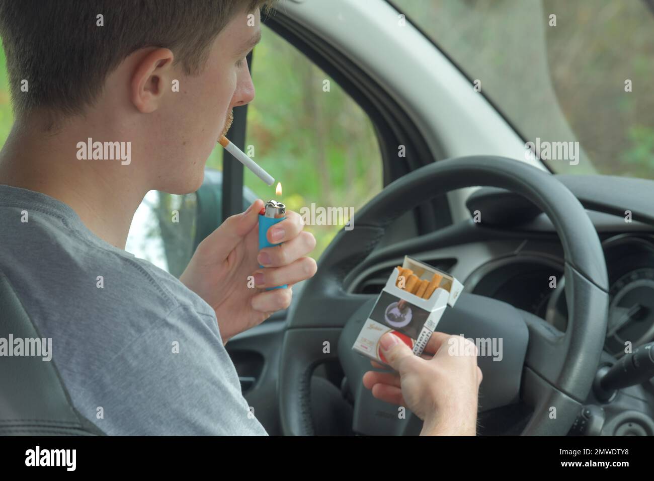 Smoking, Cigarette, Car, Symbol photo Stock Photo - Alamy