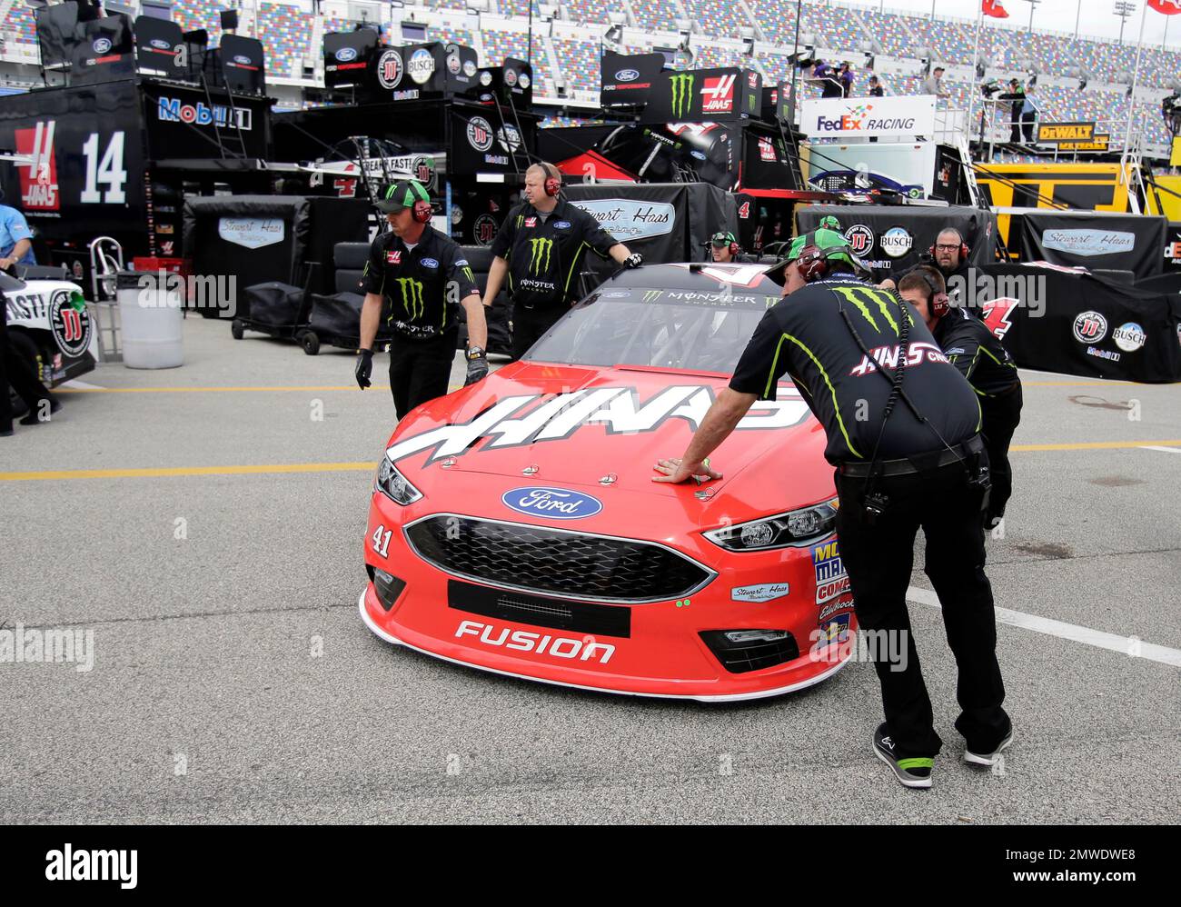 Kurt Busch's crew moves his car in the garage area during a NASCAR auto ...