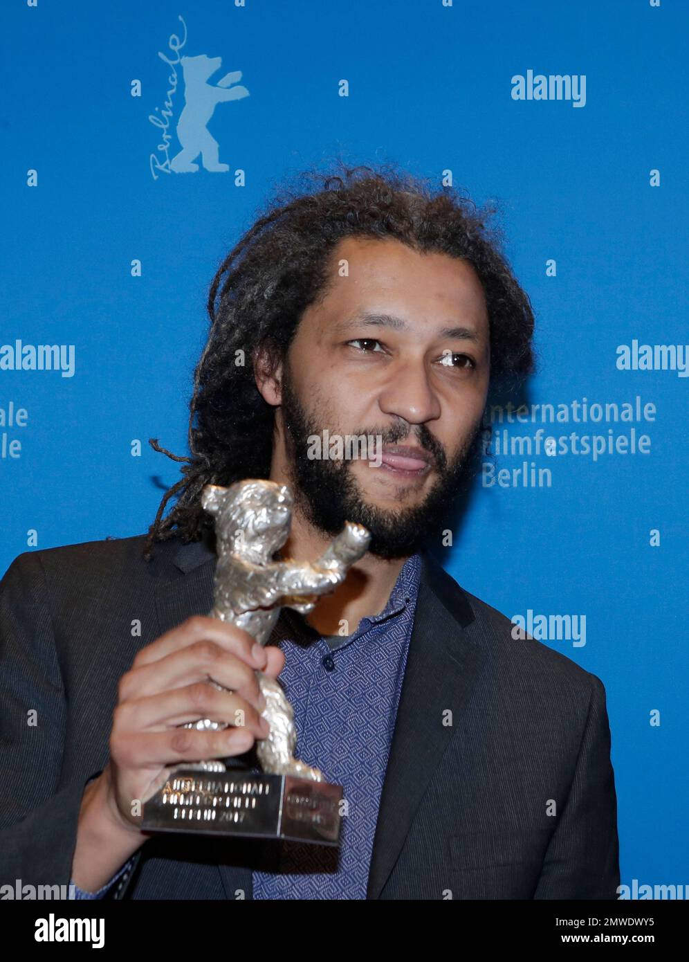 Alain Gomis poses for photographers with the Silver Bear Grand Jury ...