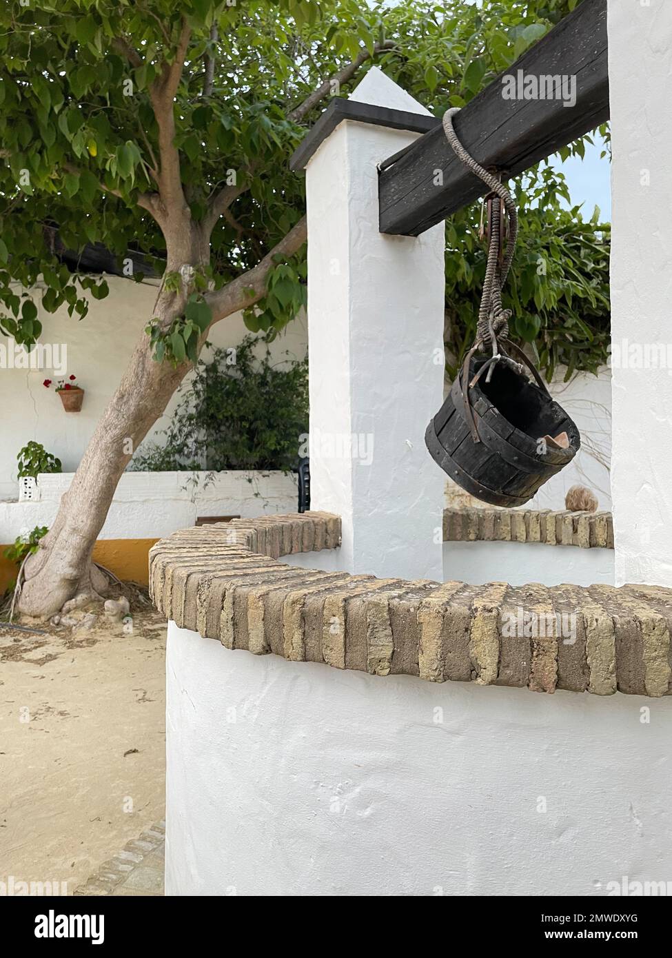 A vertical shot of a White water well with old pulley and bucket Stock ...