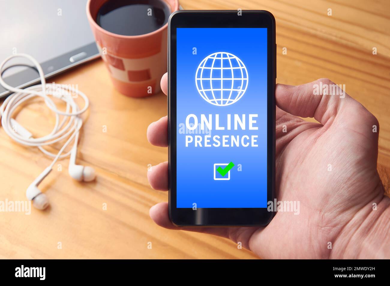 Male hand holding mobile phone with online presence report showing ...