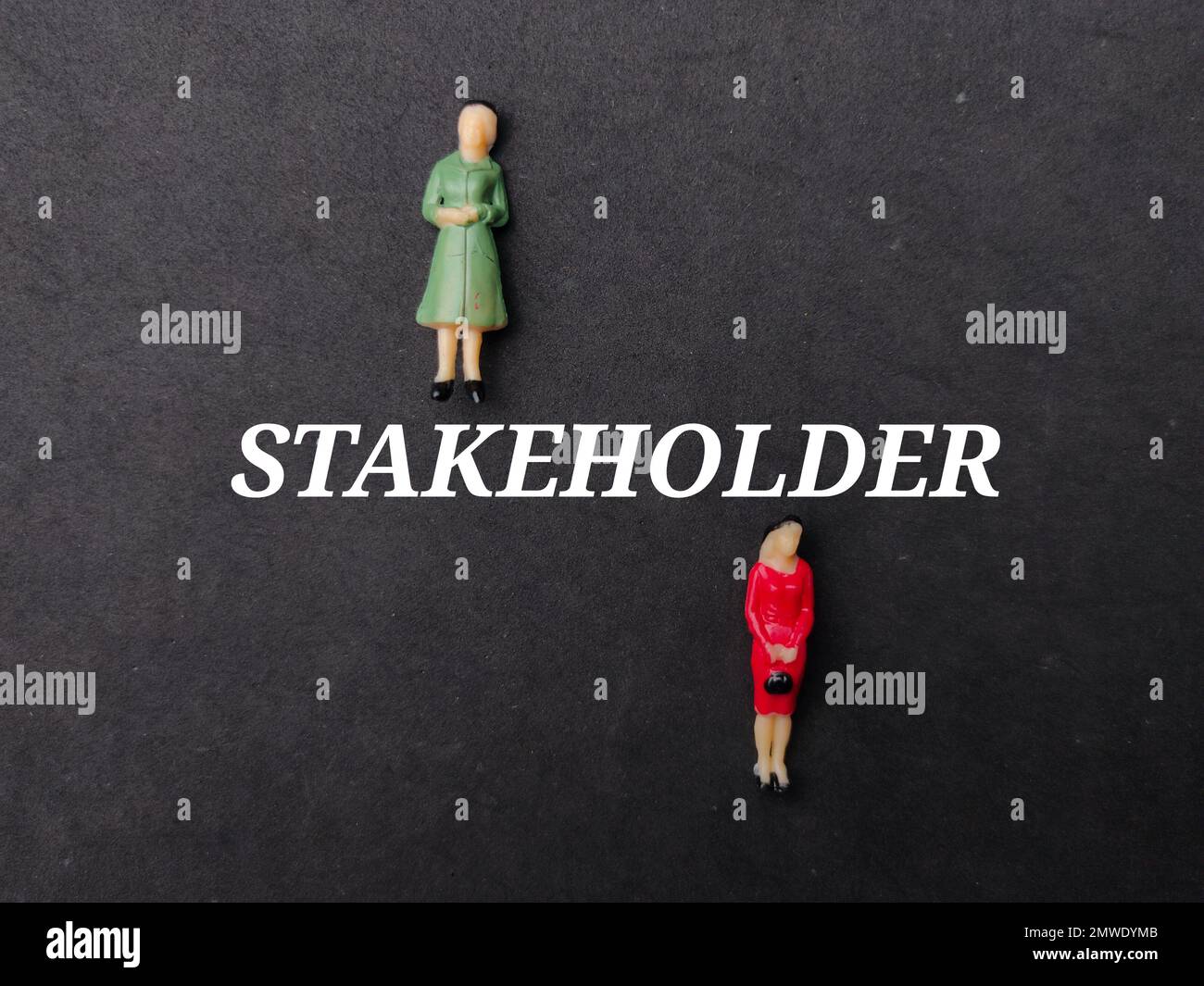 Miniature people with the word STAKEHOLDER on a black background Stock ...