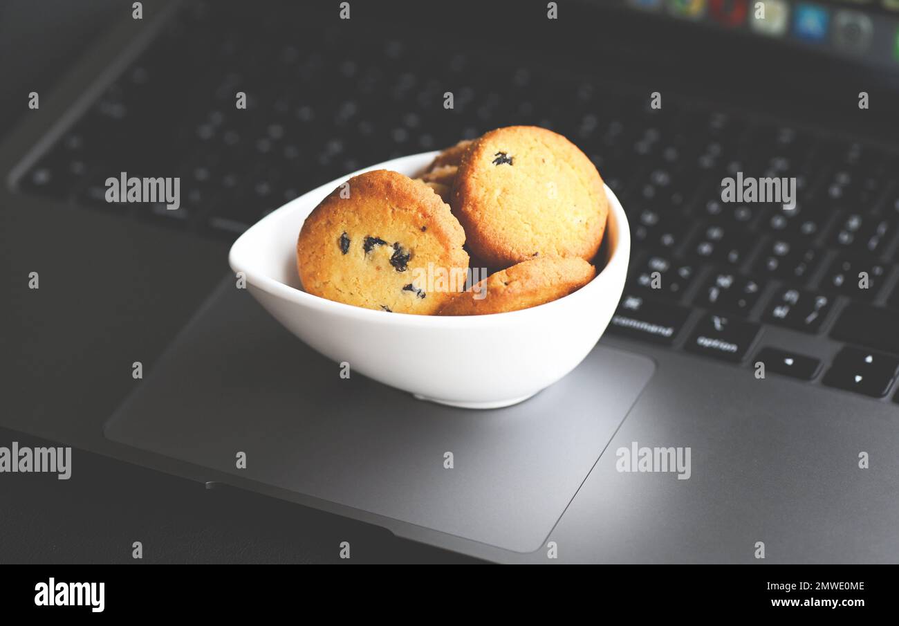 internet cookies, mini cookies on keyboard computer laptop for internet ...