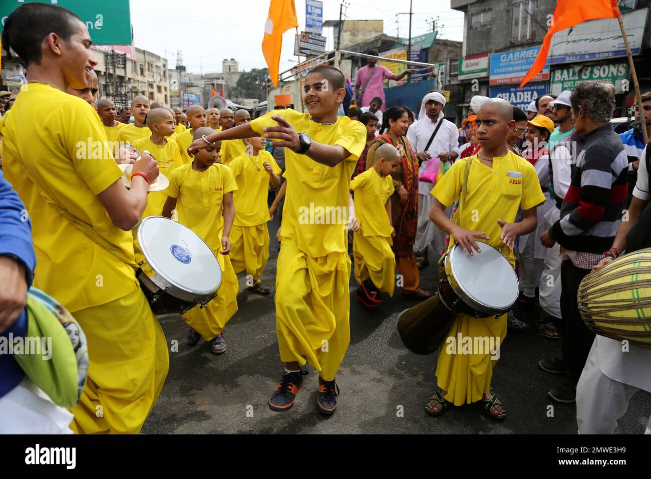 Young Hindu devotees dance during a chariot procession of Lord ...