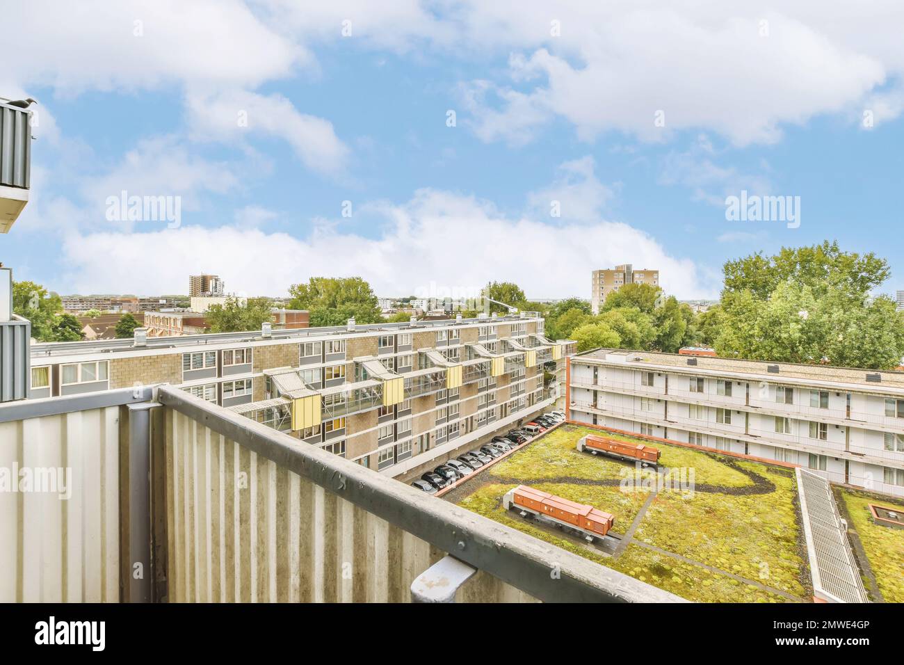 a green roof on an apartment building in portland, oregon with blue sky ...