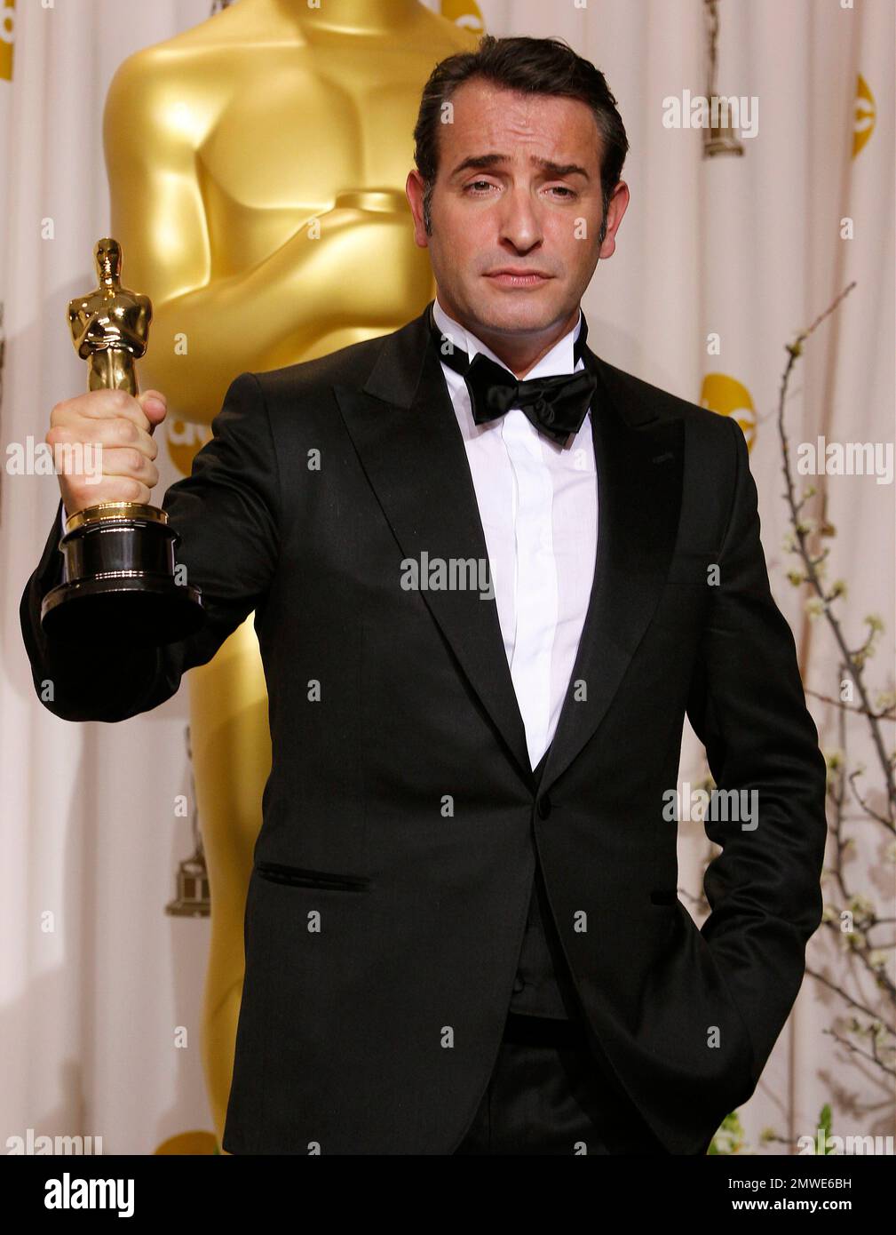 FILE - This Feb. 26, 2012 file photo shows Jean Dujardin with his award ...