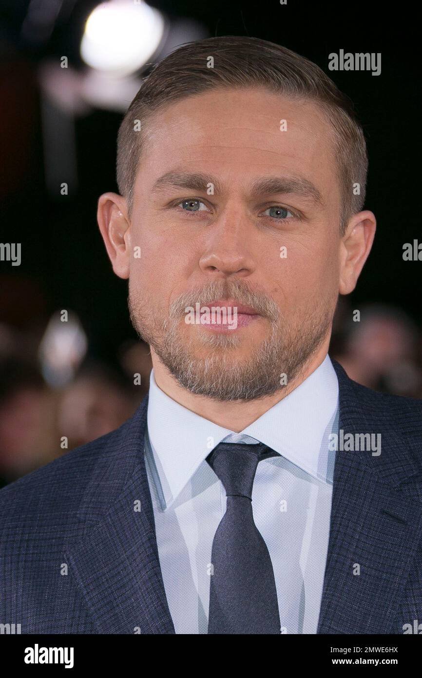 Actor Charlie Hunnam poses for photographers during the UK premiere for ...