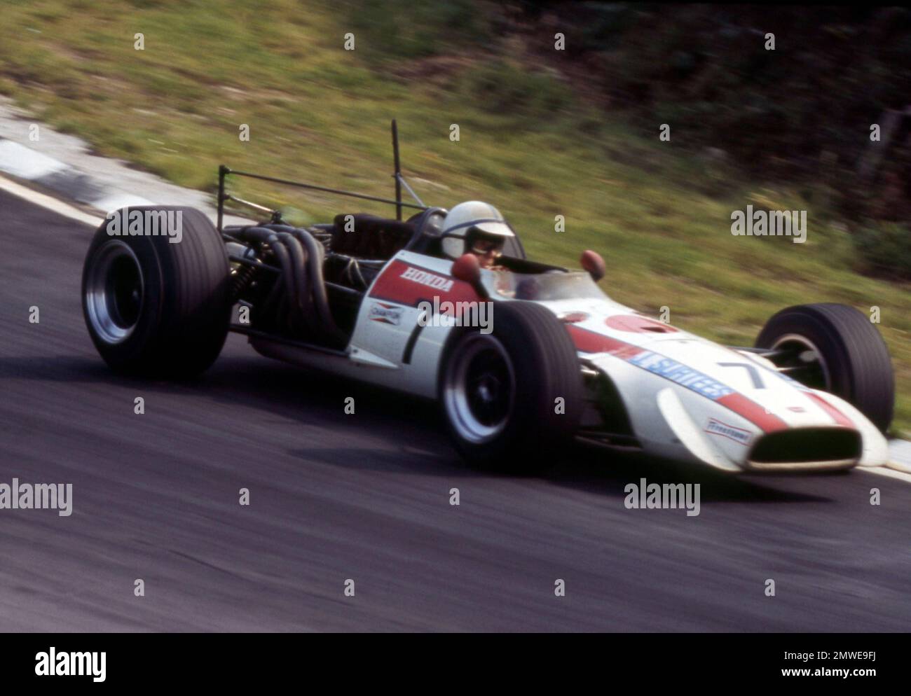 John Surtees in a Honda car in action during the British Grand Prix at ...
