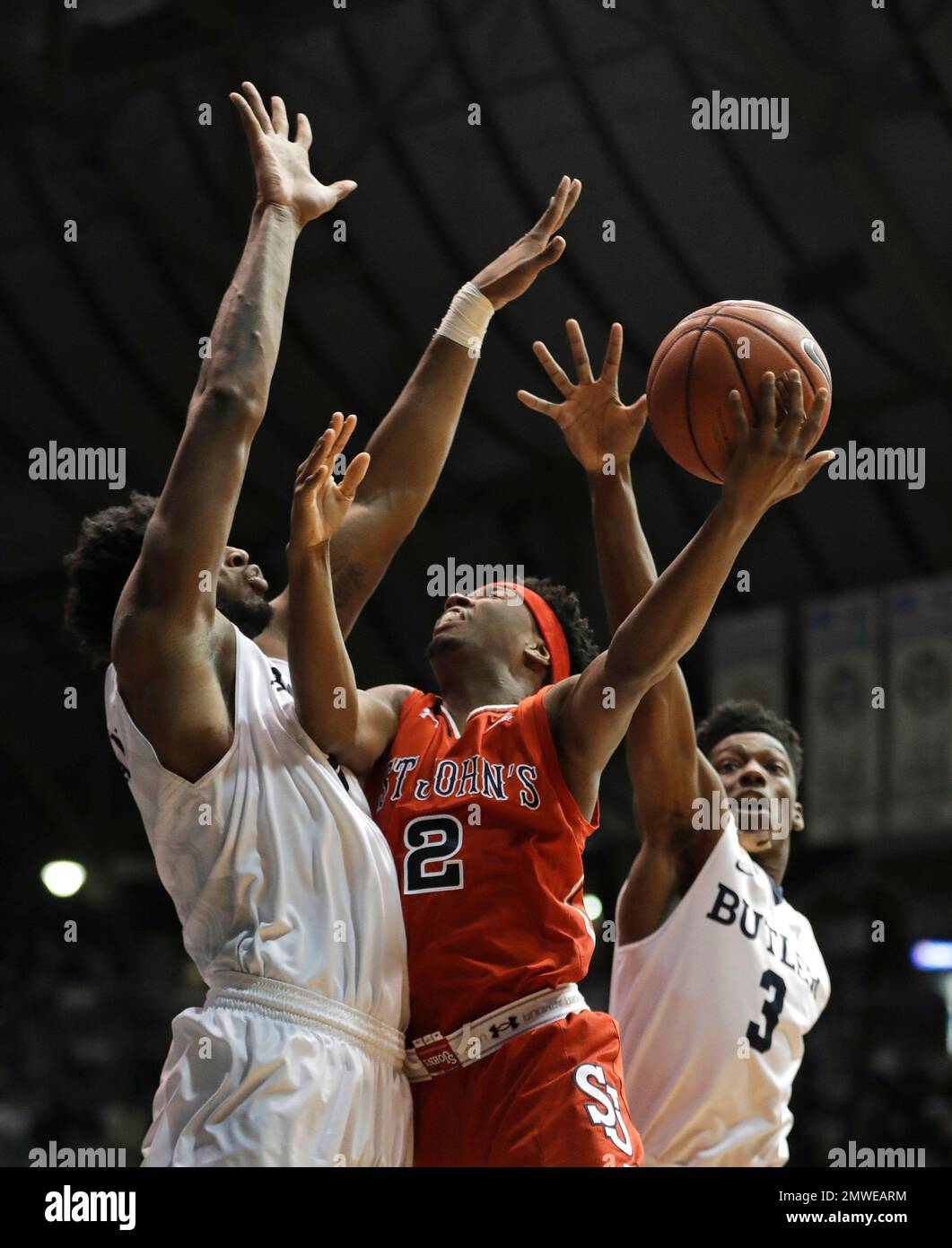 St. John's Shamorie Ponds shoots between Butler's Tyler Wideman, left ...