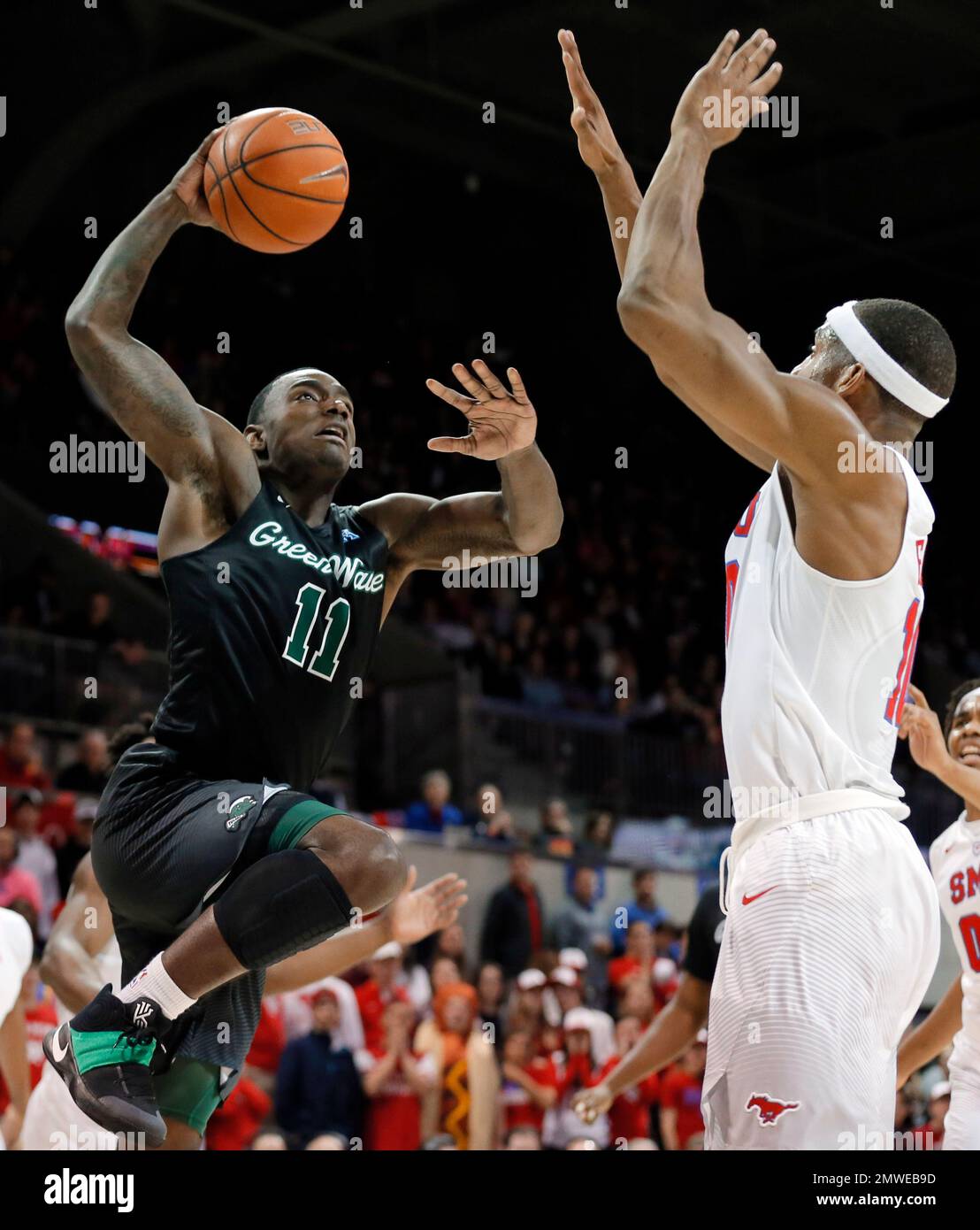 Tulane guard Kain Harris (11) goes up for a basket over SMU's Jarrey ...