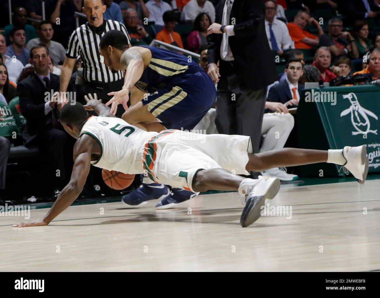 Miami's Davon Reed (5) reaches for the ball in front of Georgia Tech's ...