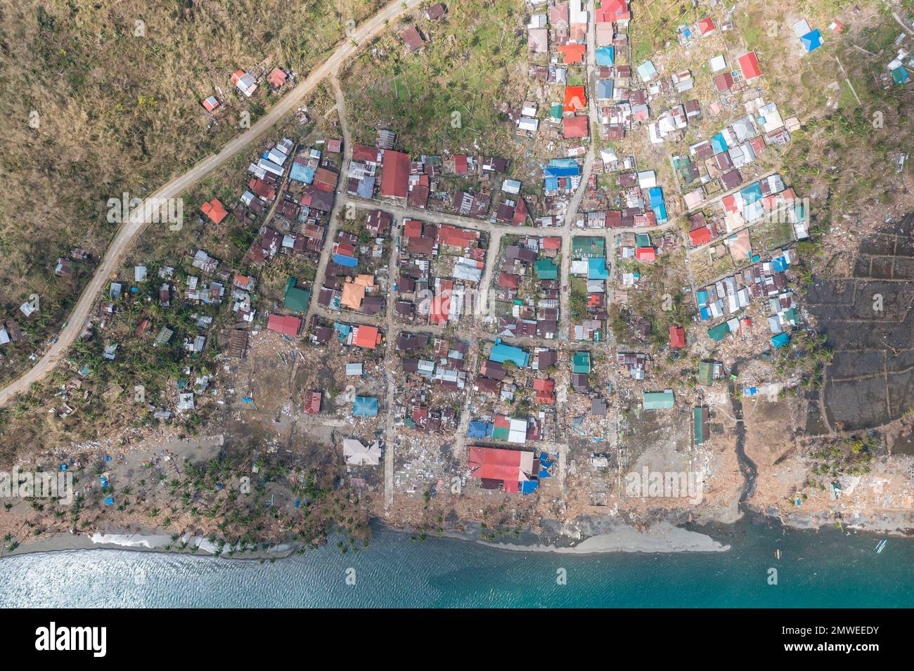 An aerial shot of houses in a small village with colorful rooftops ...