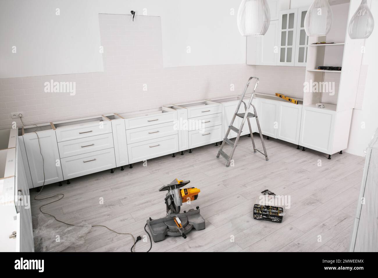 Stylish kitchen interior with newly installed furniture Stock Photo - Alamy