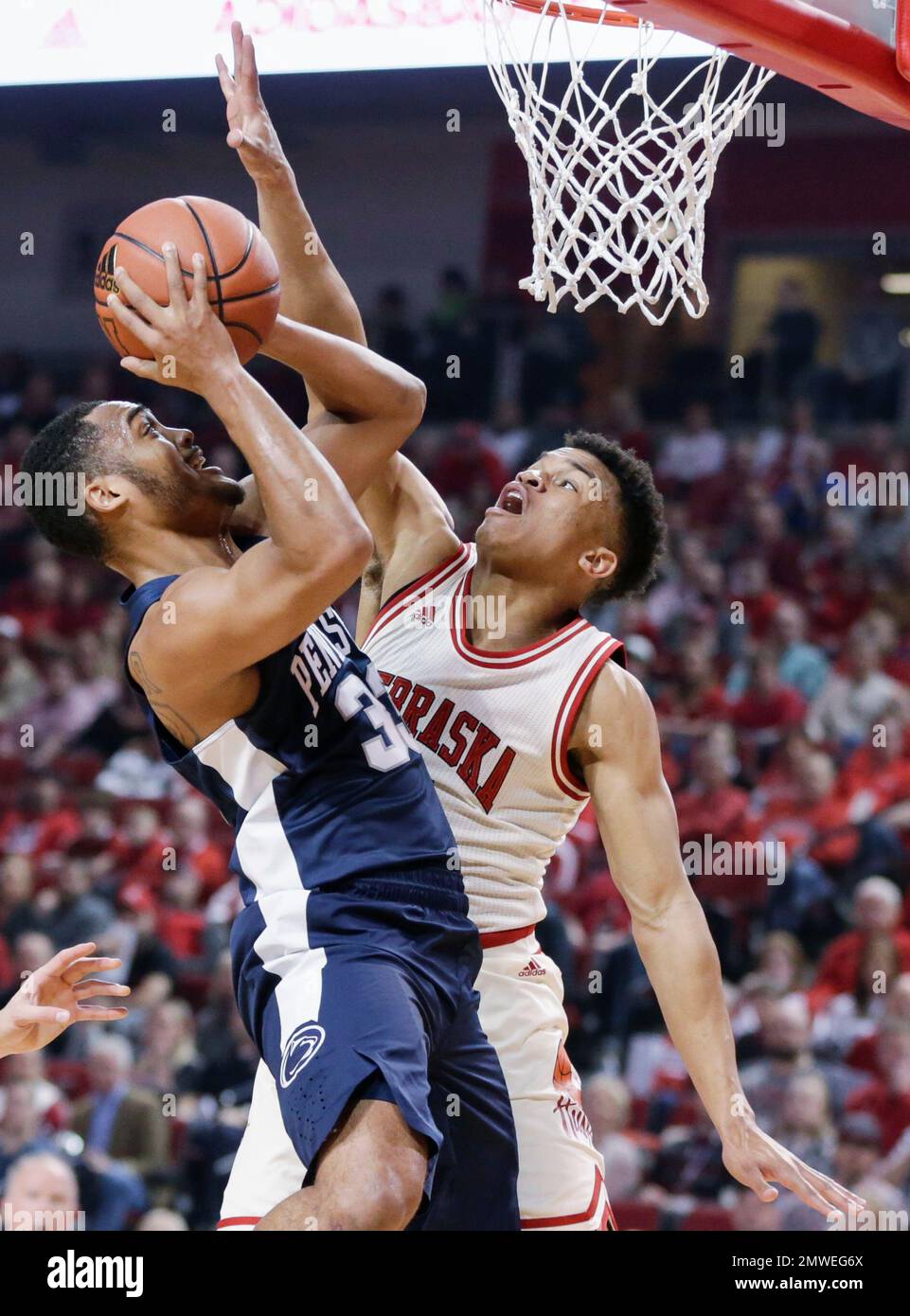 Penn State's Shep Garner (33) is defended by Nebraska's Evan Taylor ...