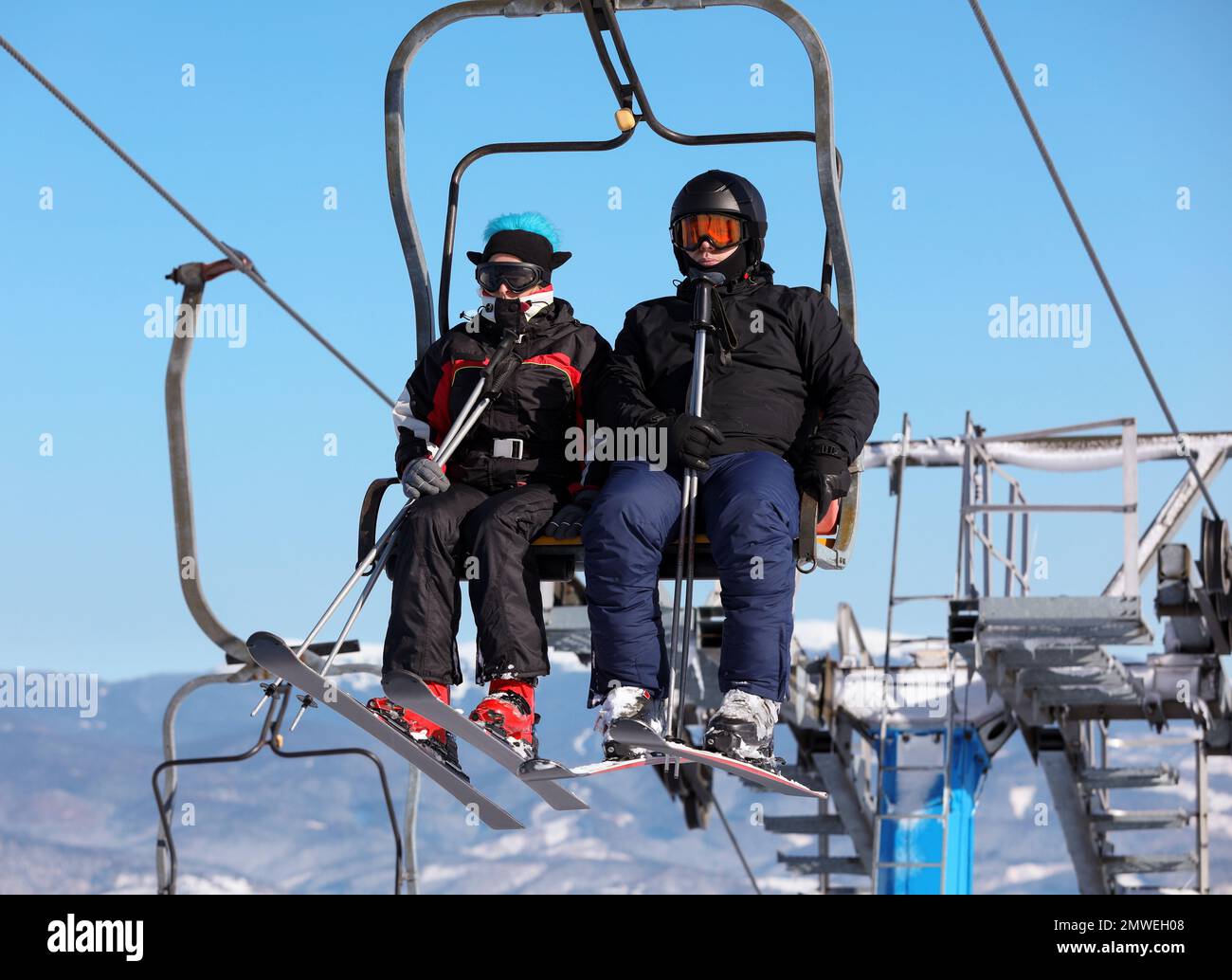 People using chairlift at mountain ski resort. Winter vacation Stock ...