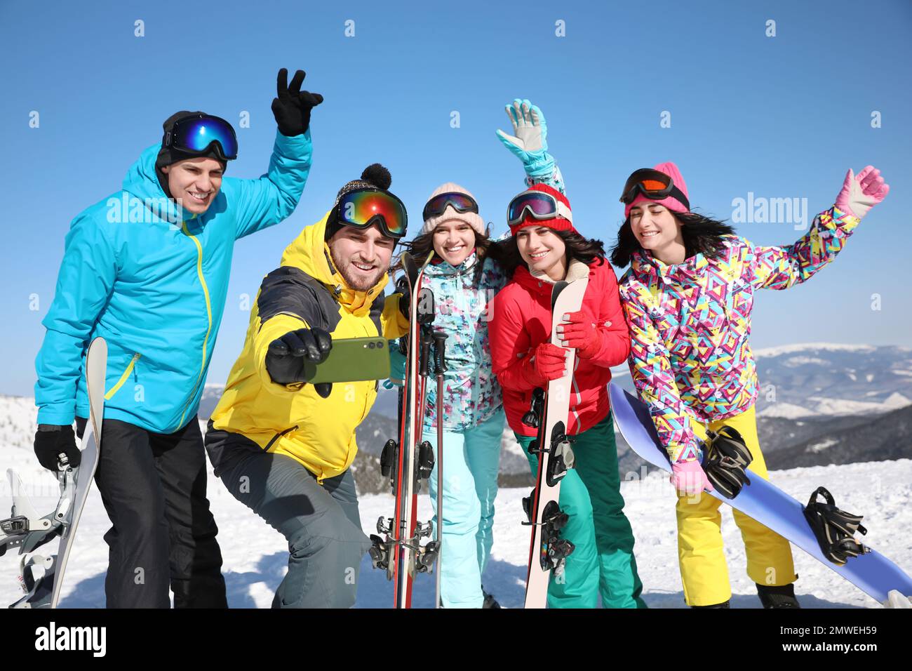 Group of friends with equipment at ski resort. Winter vacation Stock ...