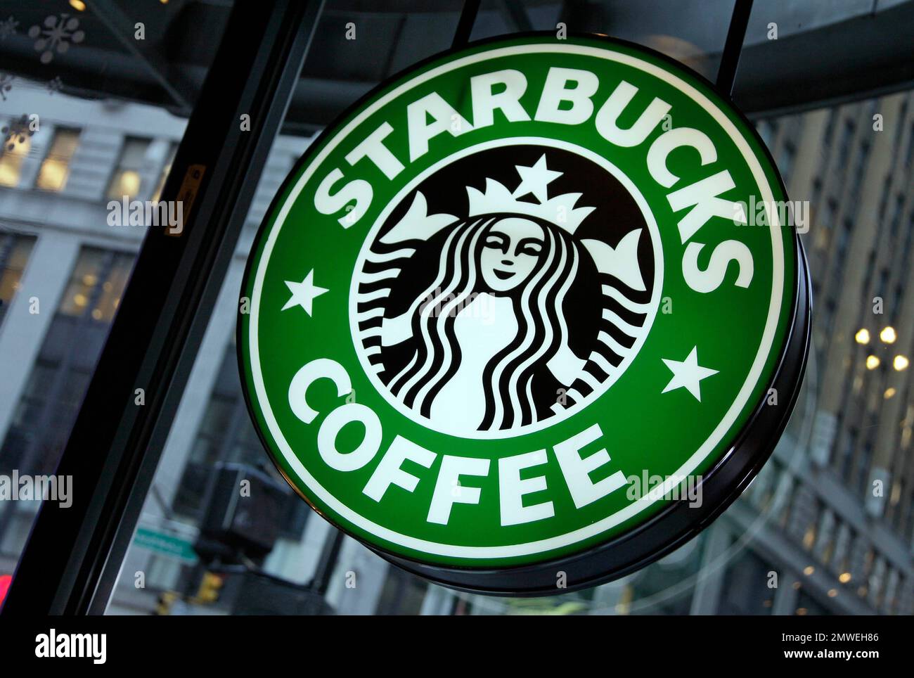 FILE - This Dec. 20, 2010 file photo shows signage at a Starbucks store ...