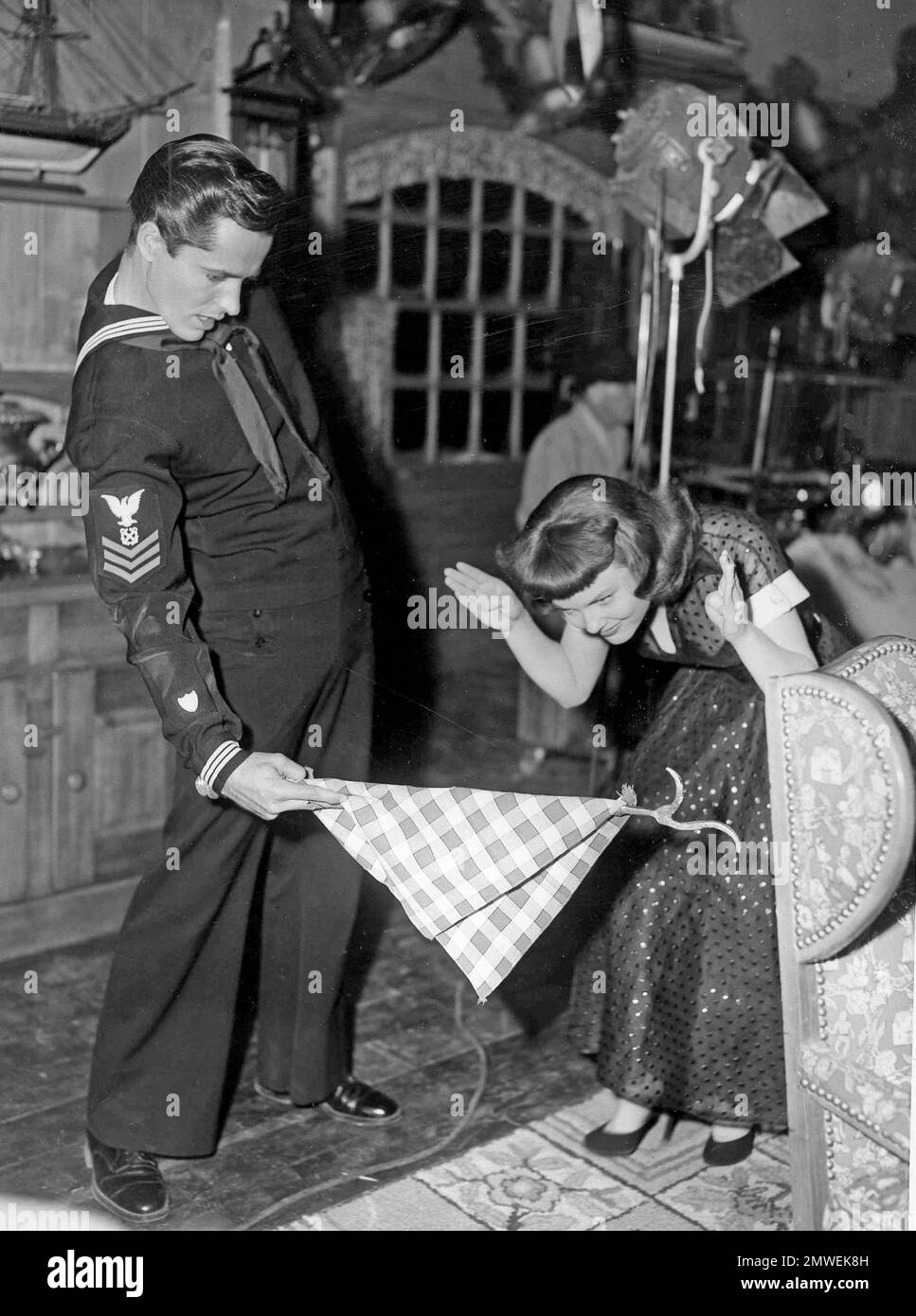 Wanda Hendrix makes like a toro as her co-star John Derek plays matador ...