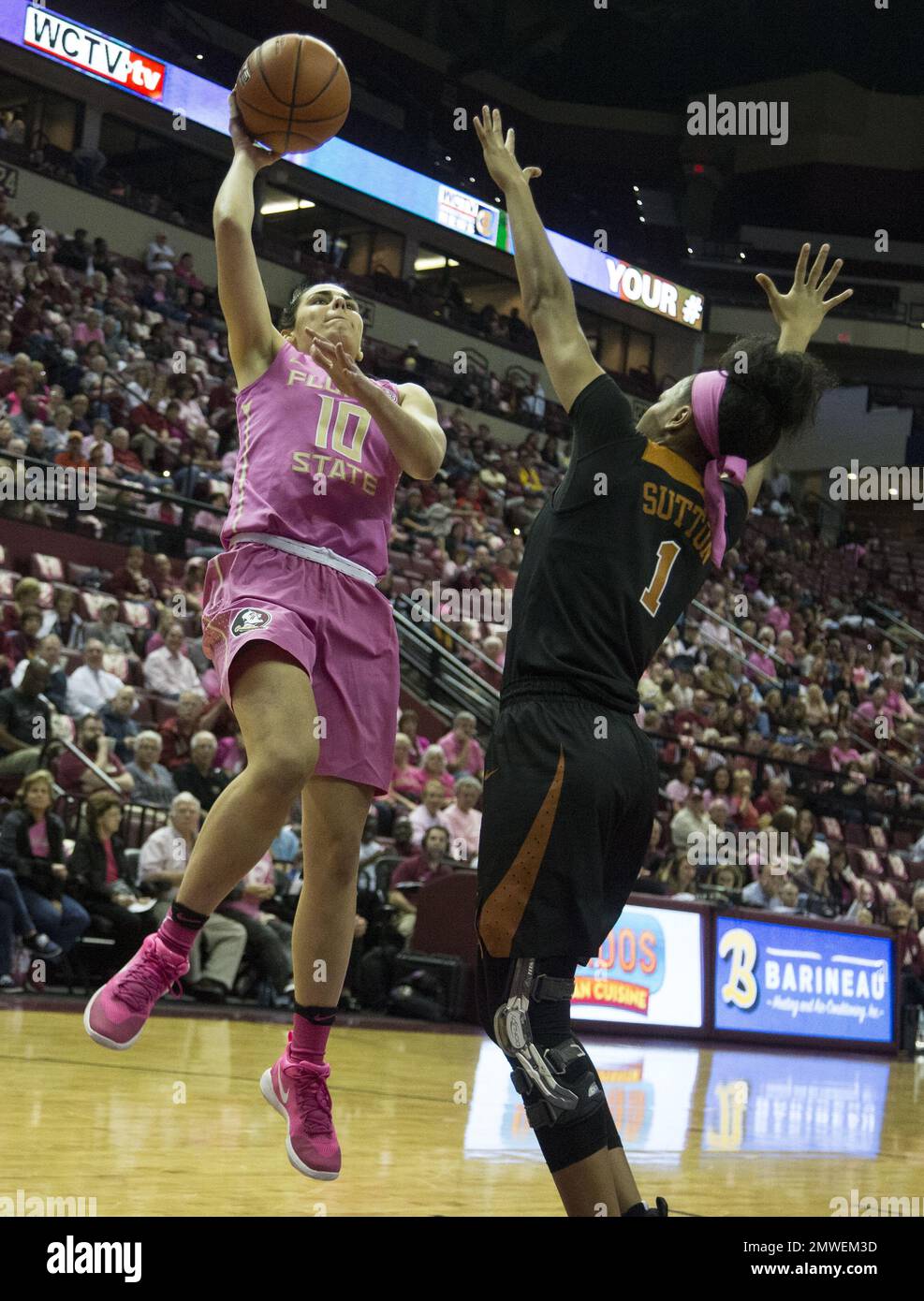 Florida State's Maria Conde shoots over Texas' Alecia Sutton in the ...