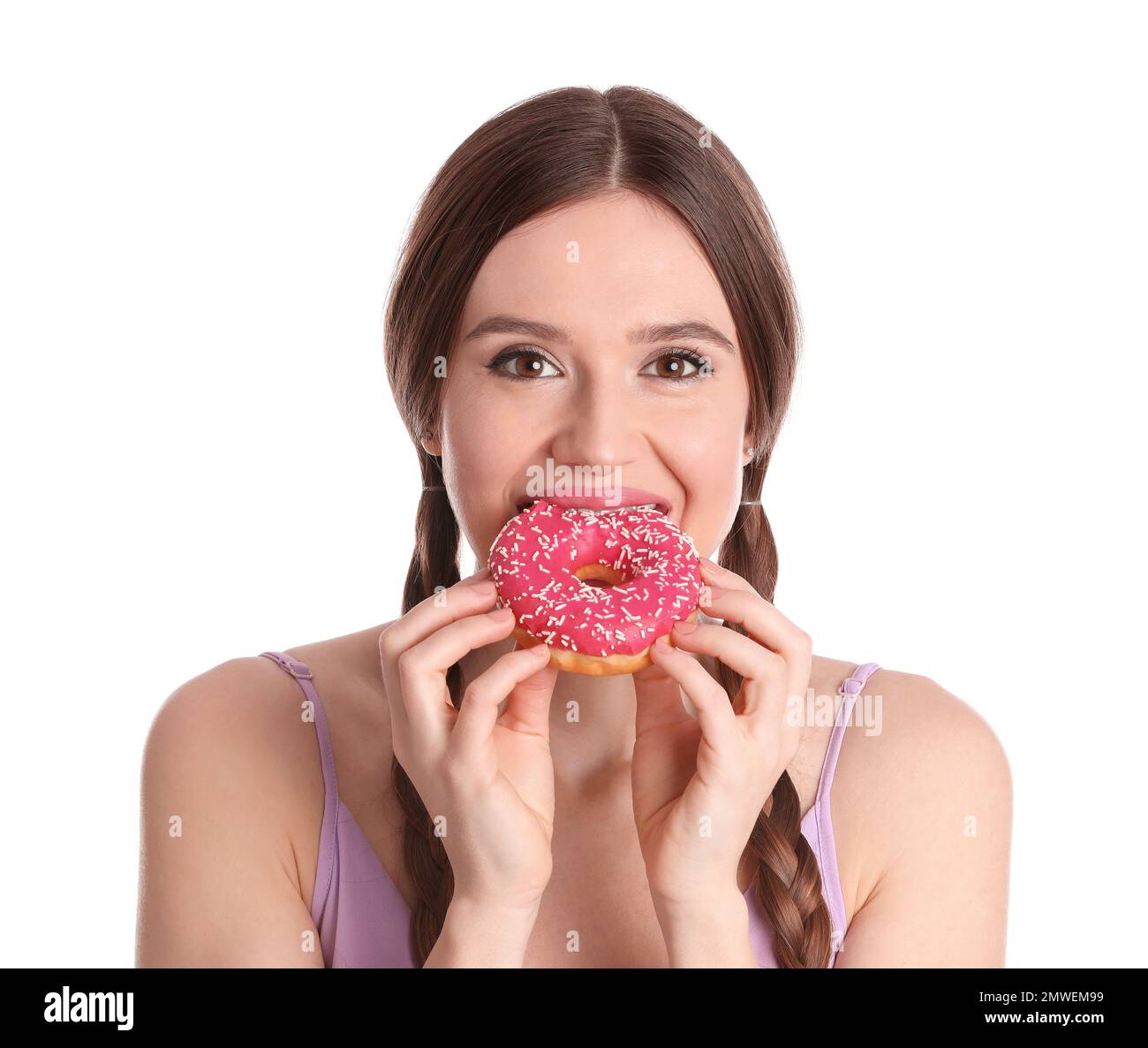 Beautiful young woman eating donut on white background Stock Photo - Alamy