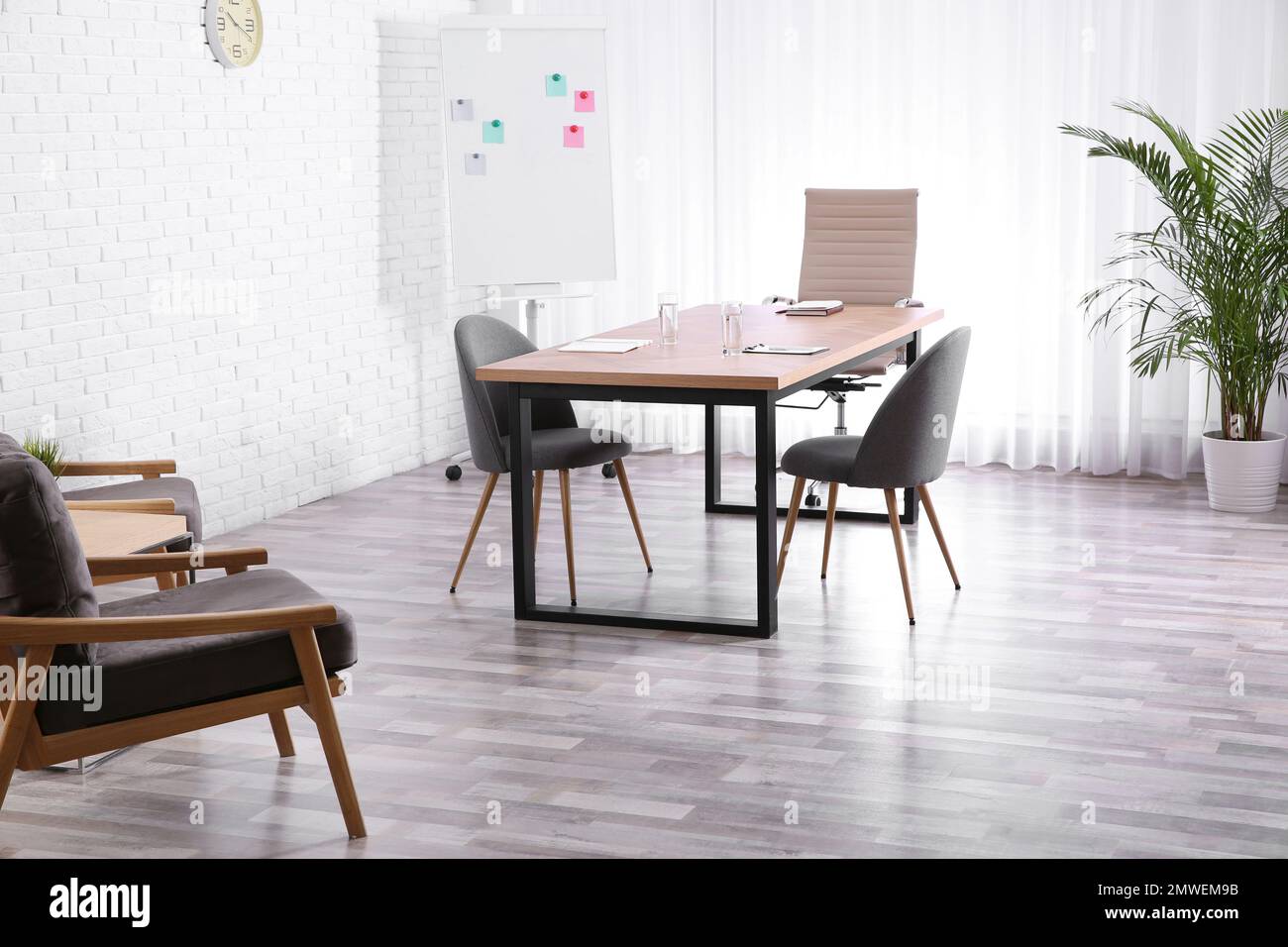 Interior of modern office with table and chairs Stock Photo - Alamy