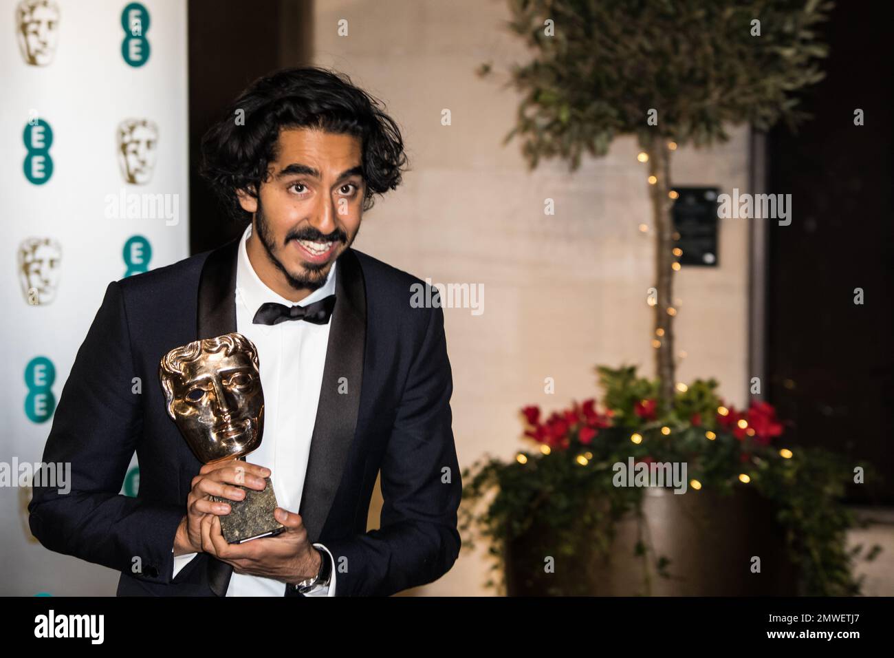 Dev Patel poses for photographers upon arrival at the BAFTA Film Awards ...