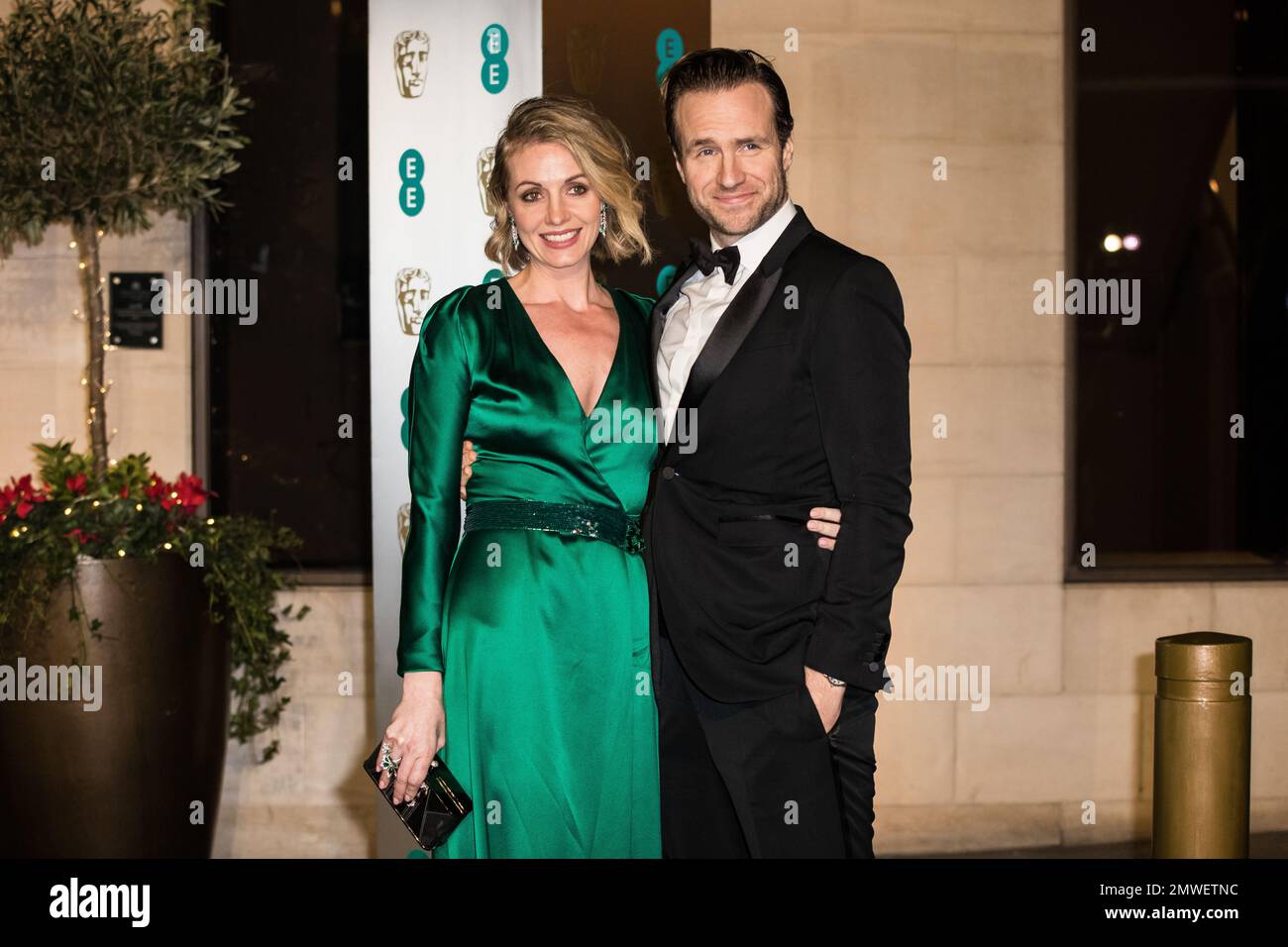 Elize Du Toit and Rafe Spall pose for photographers upon arrival at the ...