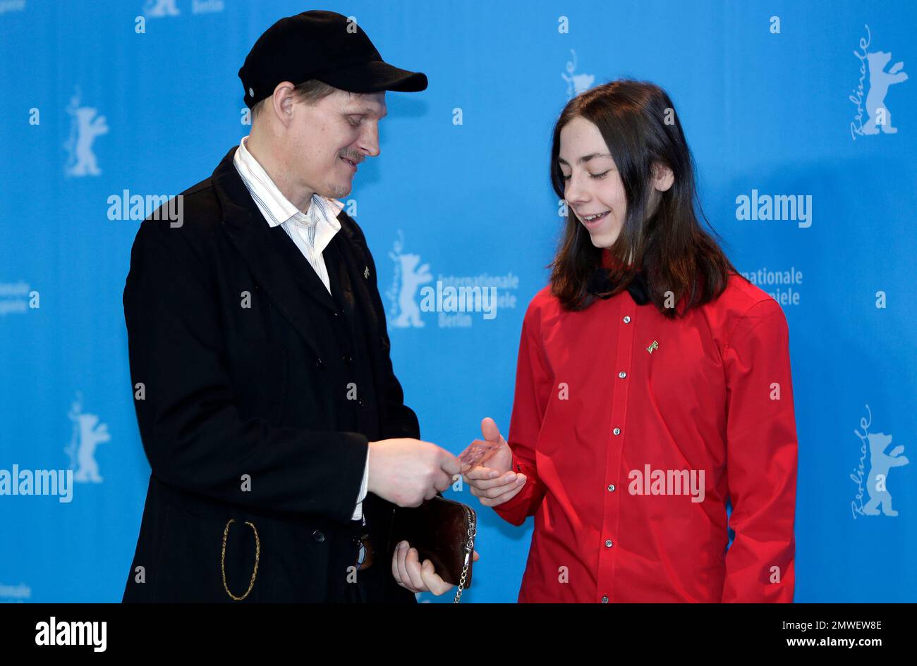 Actor Georg Friedrich, left, hands over a 50 Euro note for fun to actor ...