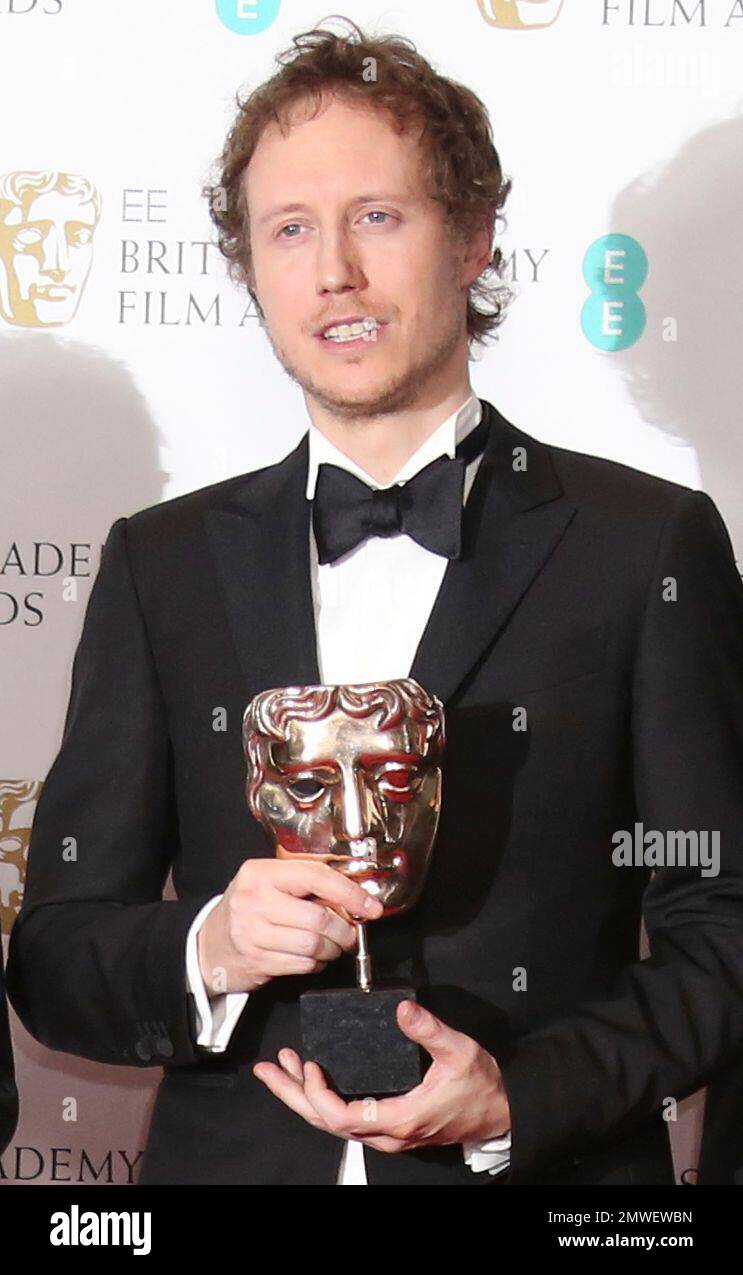 Director Laszlo Nemes poses with his BAFTA award for the Best Film Not ...