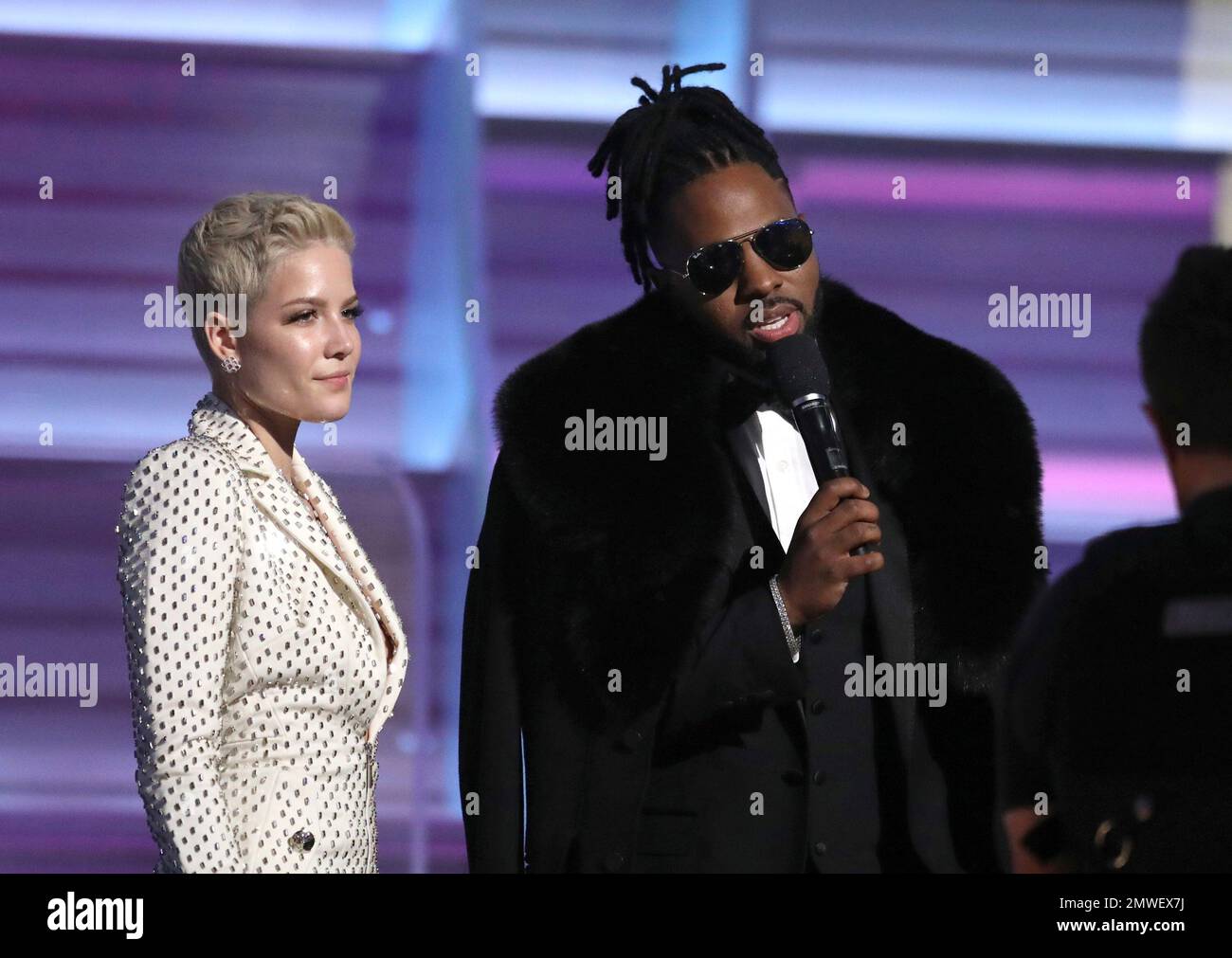 Halsey, left, and Jason Derulo speak on stage at the 59th annual Grammy ...