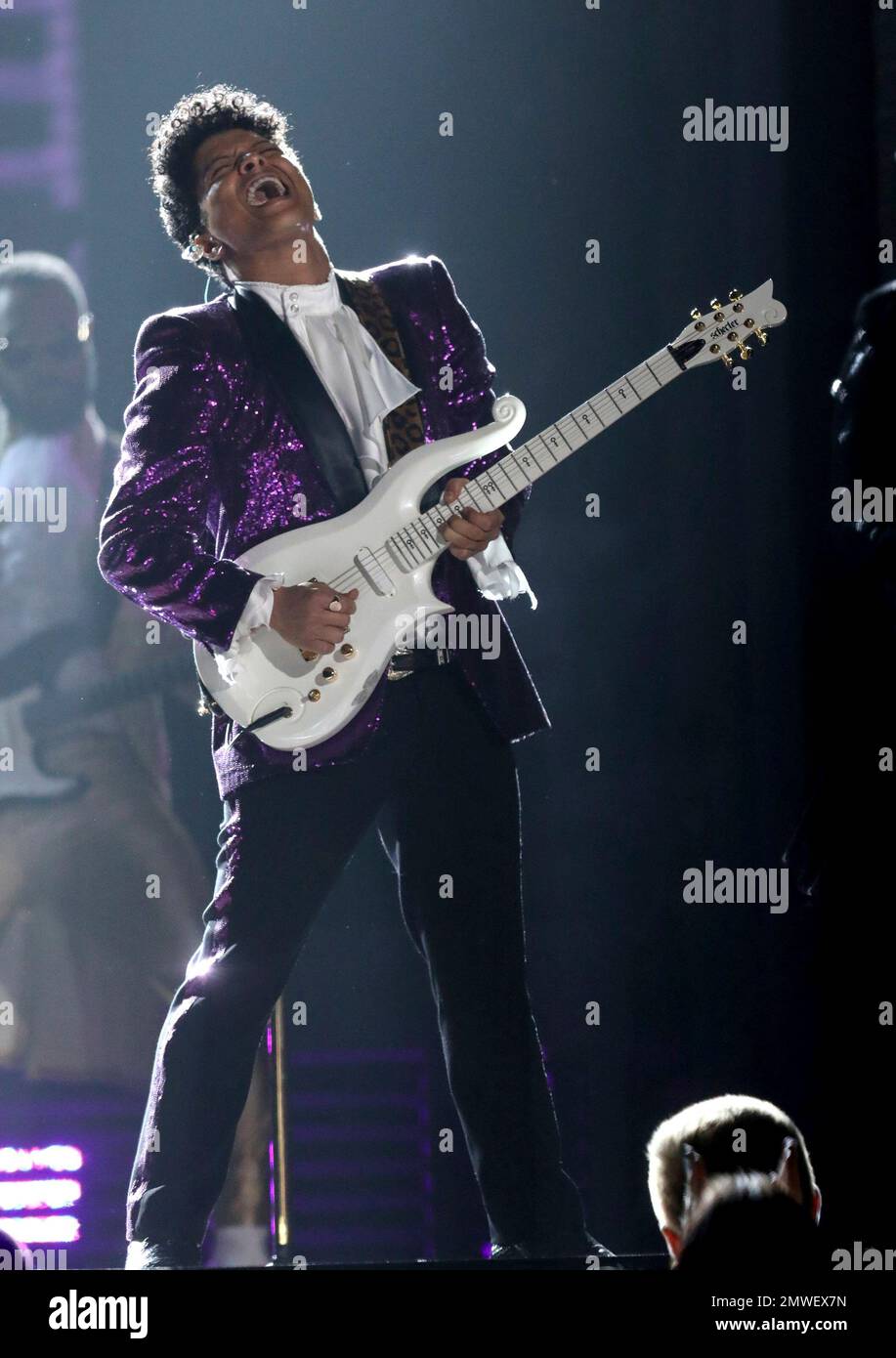 Bruno Mars performs "Let's Go Crazy" during a tribute to Prince at the ...