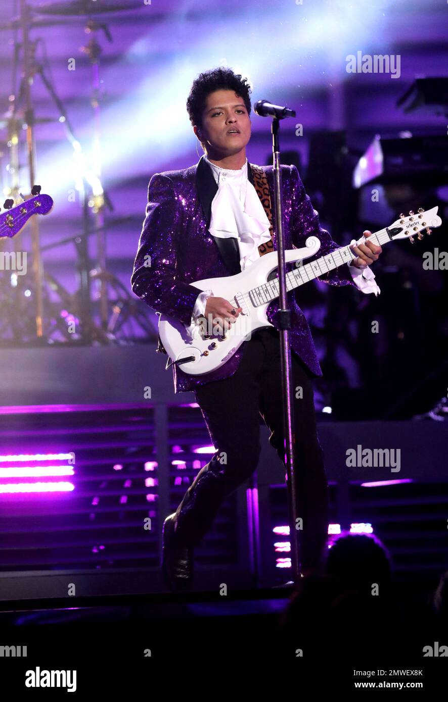 Bruno Mars performs a tribute to Prince at the 59th annual Grammy ...