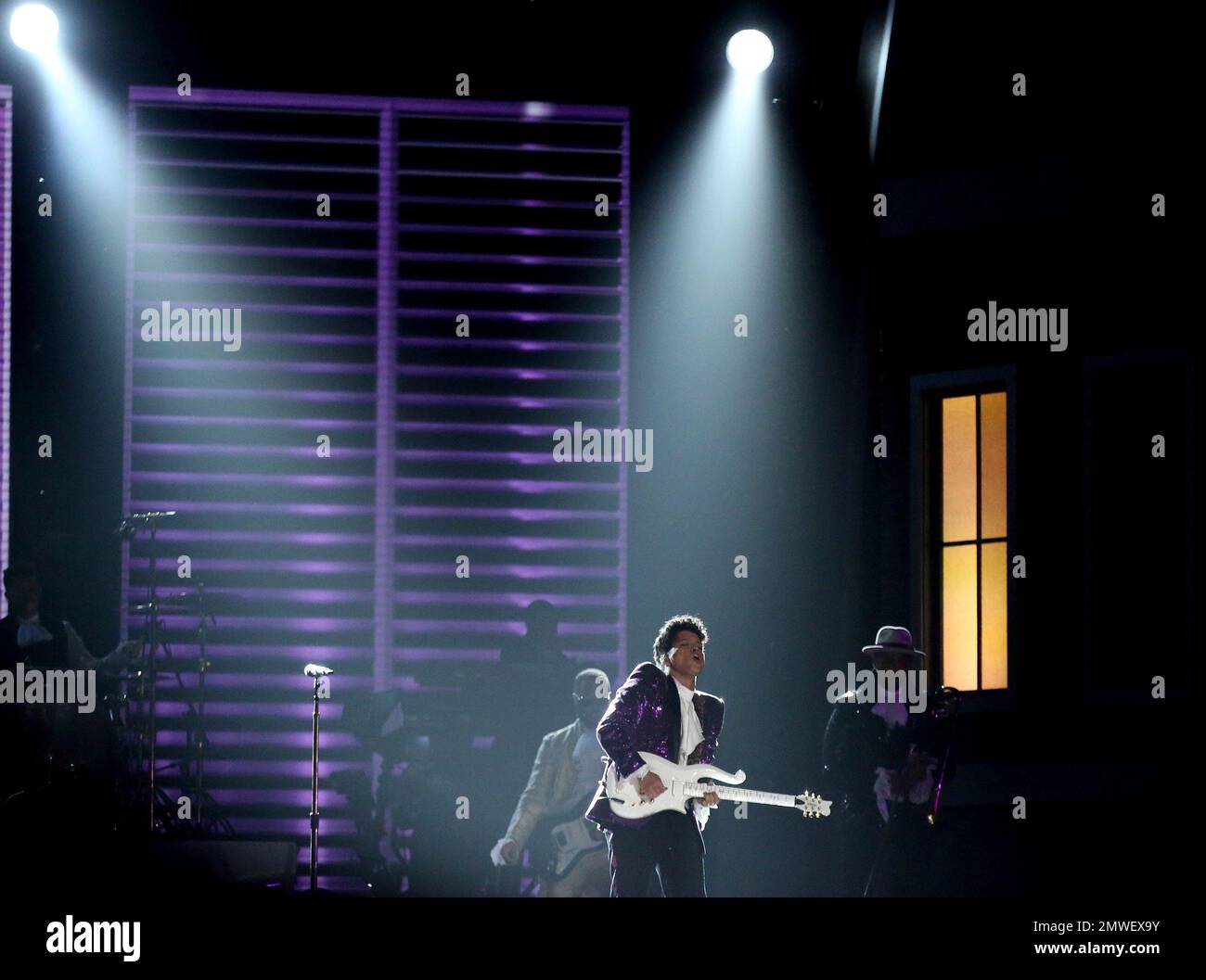 Bruno Mars performs a tribute to Prince at the 59th annual Grammy ...