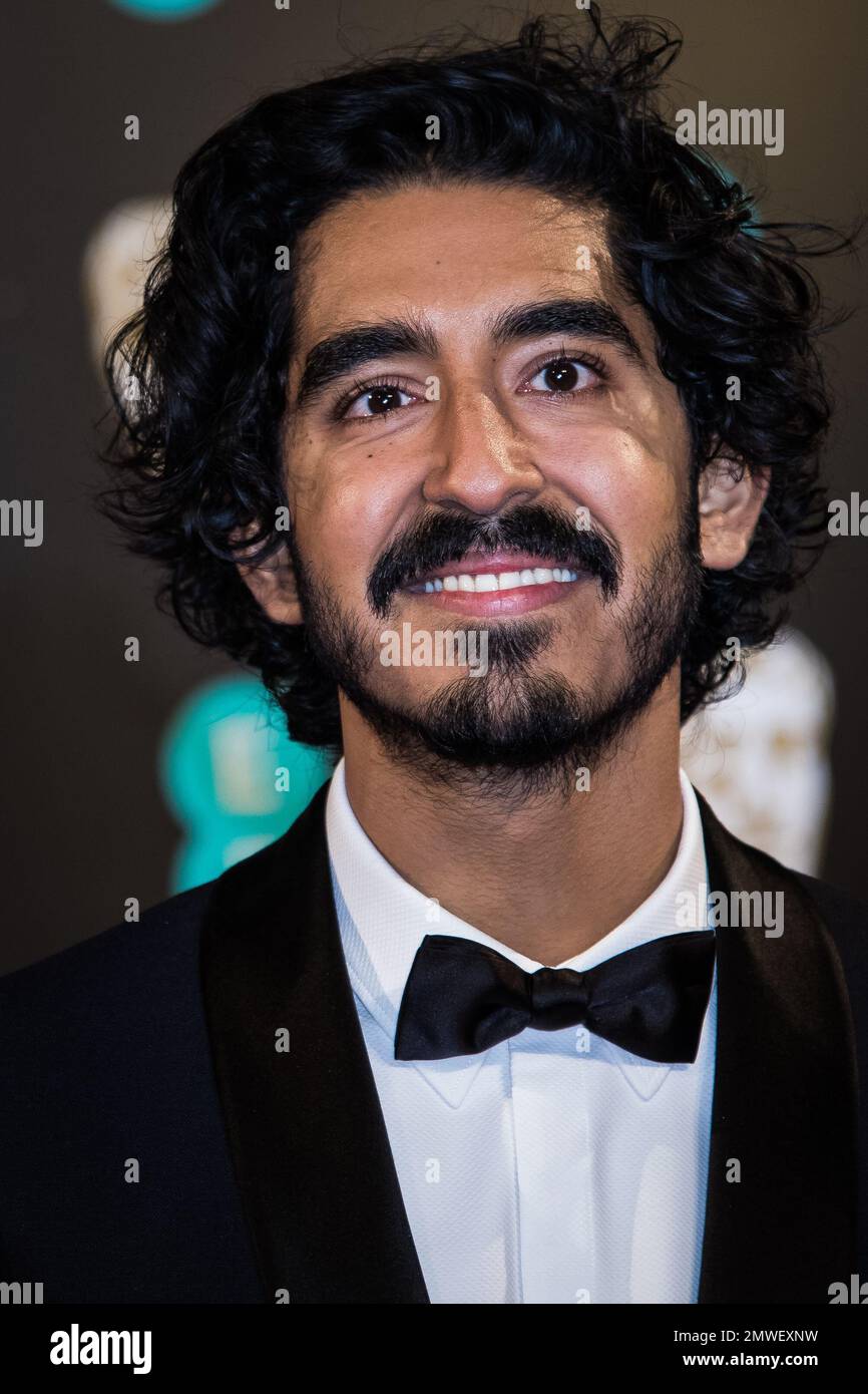 Dev Patel poses for photographers upon arrival at the BAFTA Film Awards ...