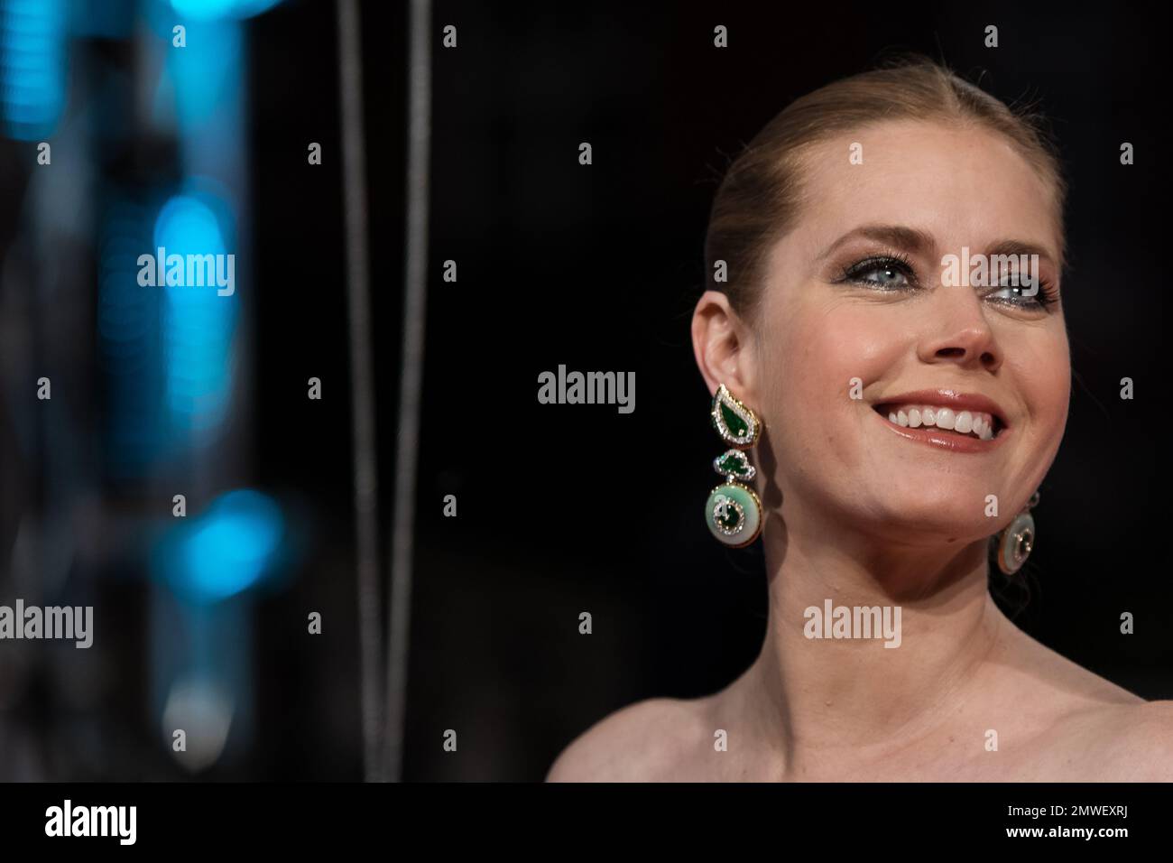 Amy Adams poses for photographers upon arrival at the BAFTA Film Awards ...