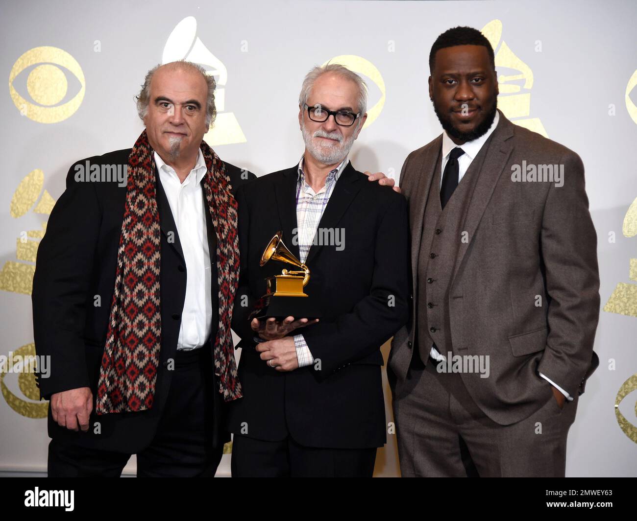 Steve Berkowitz, from left, Jeff Rosen, and Robert Glasper pose in the ...