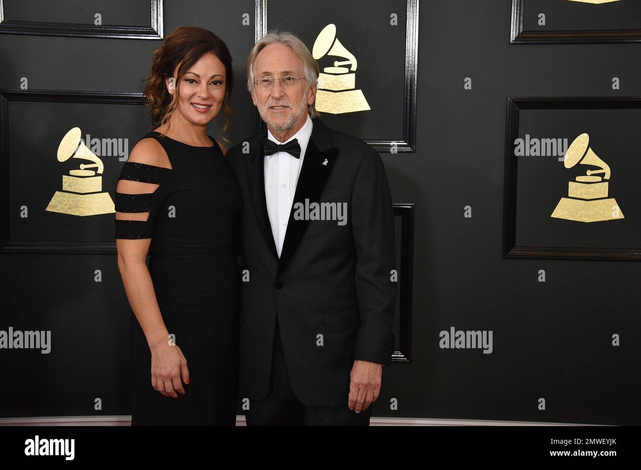Michele Tebbe, left, and Neil Portnow arrive at the 59th annual Grammy ...