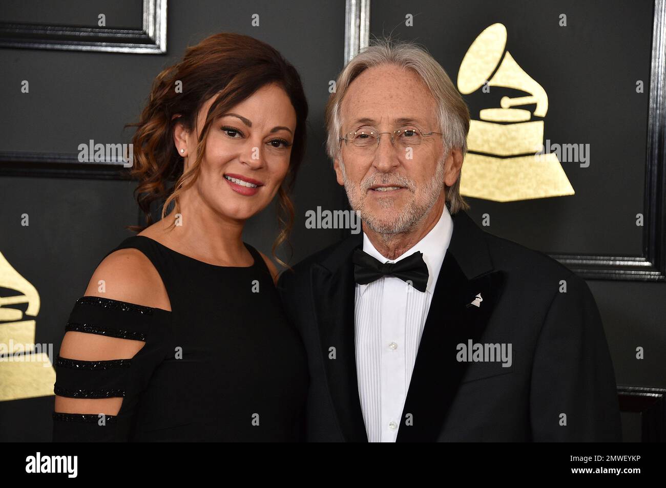 Michele Tebbe, left, and Neil Portnow arrive at the 59th annual Grammy ...