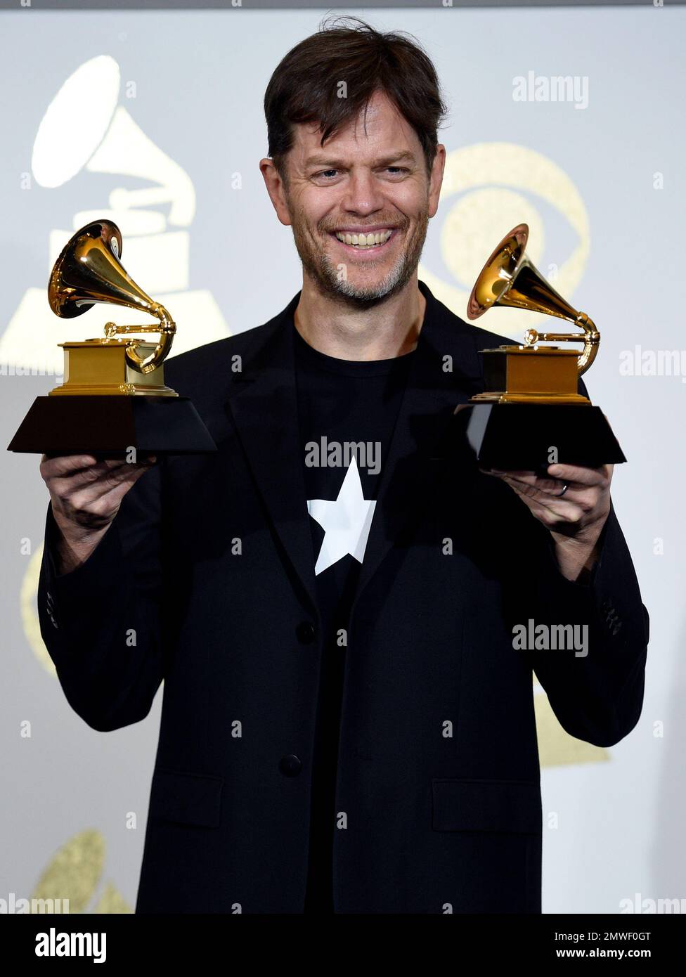 Donny McCaslin poses in the press room with the awards for at the 59th ...