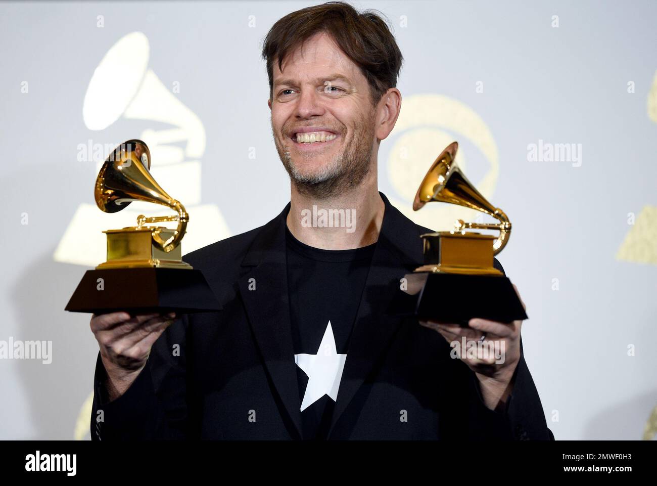 Donny McCaslin poses in the press room with the awards for at the 59th ...