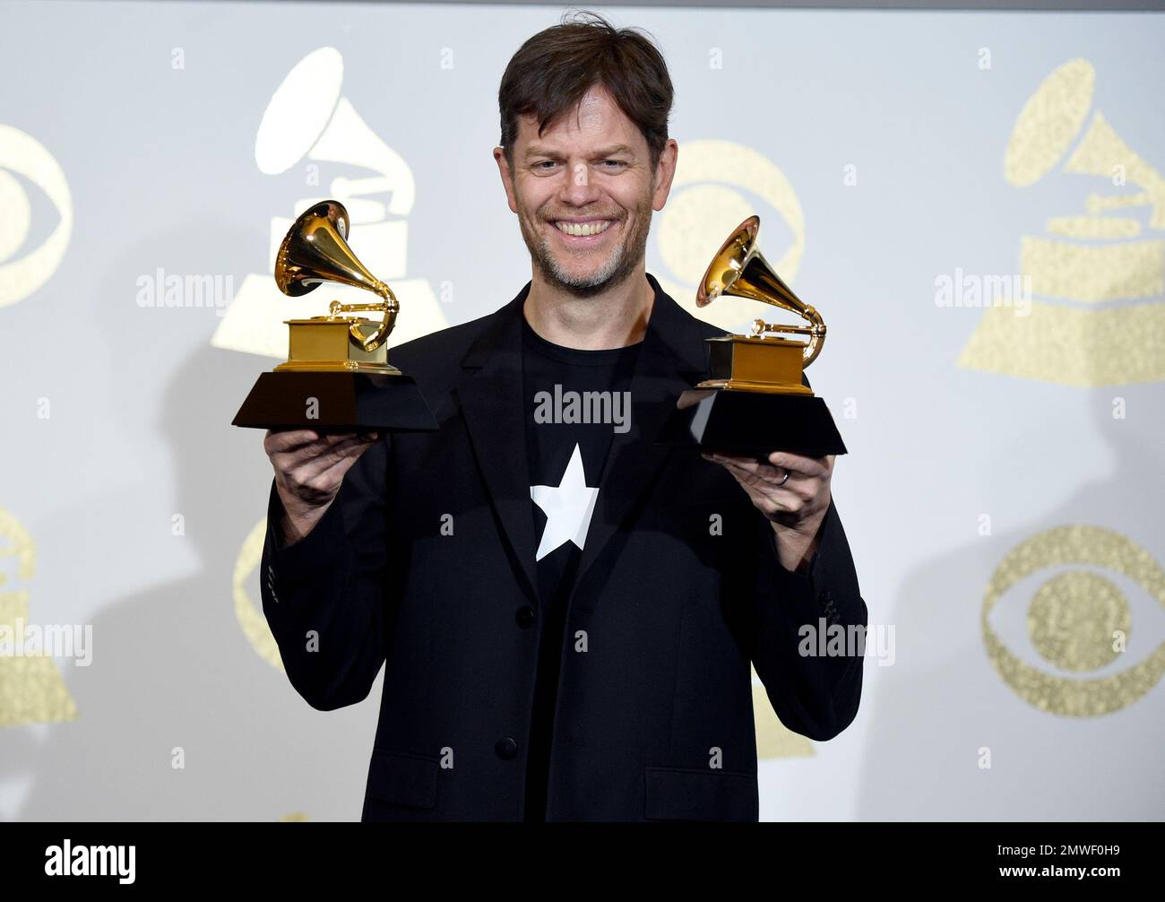 Donny McCaslin poses in the press room with the awards for at the 59th ...