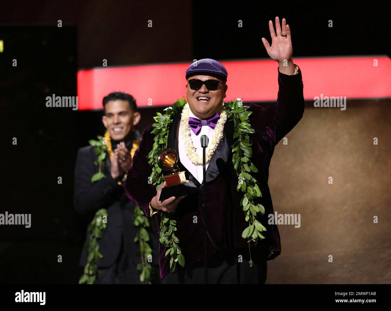 Kalani Pe'a accepts the award for best regional roots music album for ...