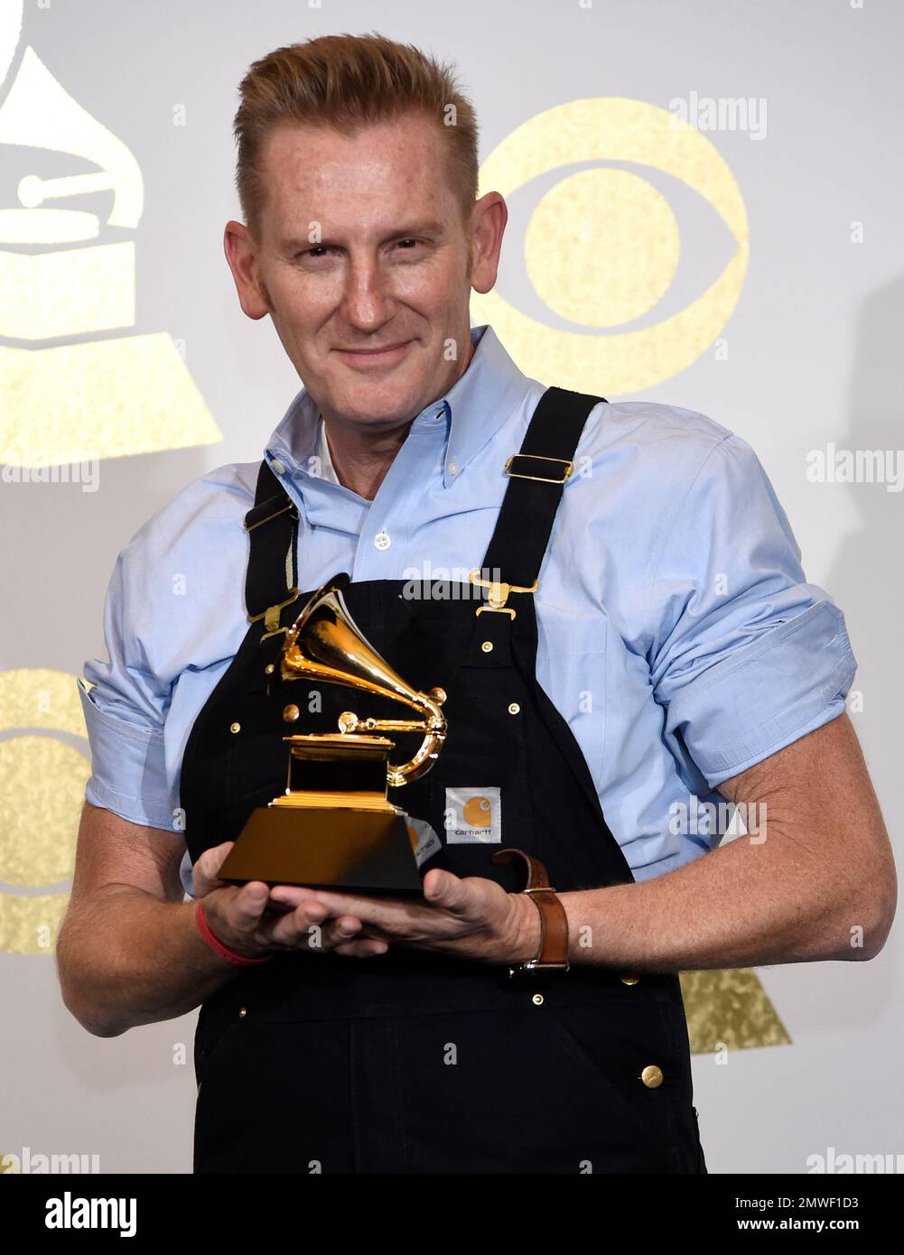 Rory Lee Feek, of Joey + Rory, poses in the press room with the award ...