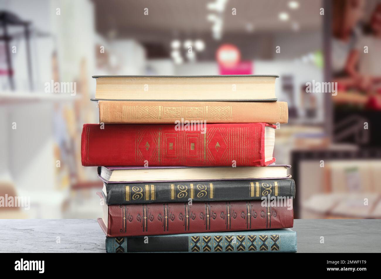 Collection of different books on table against blurred background Stock ...