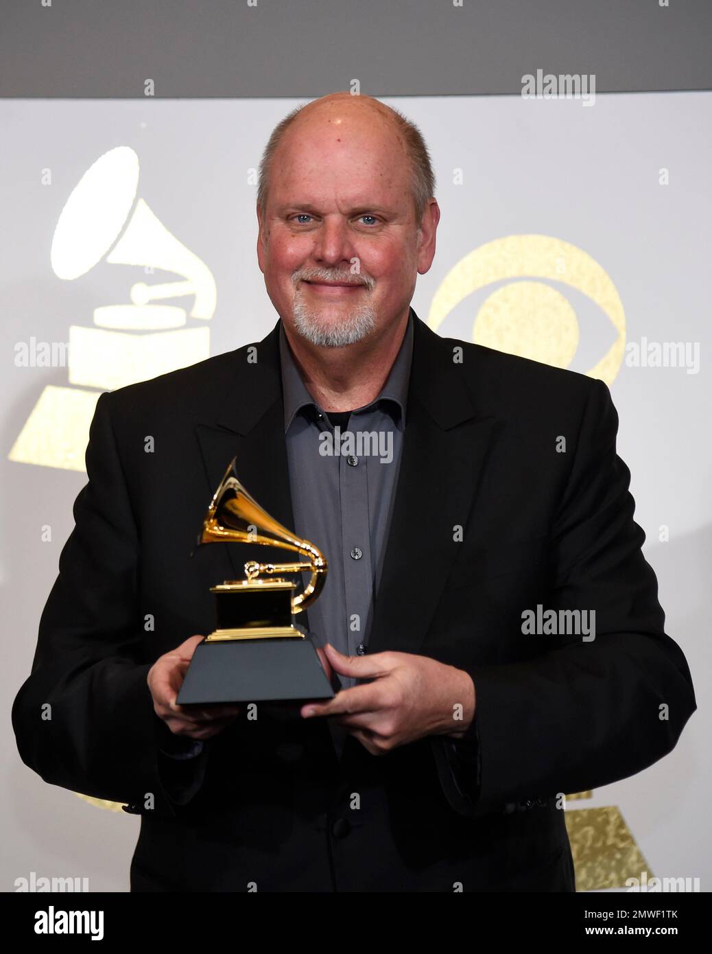 Michael Daugherty poses in the press room with the award for best ...