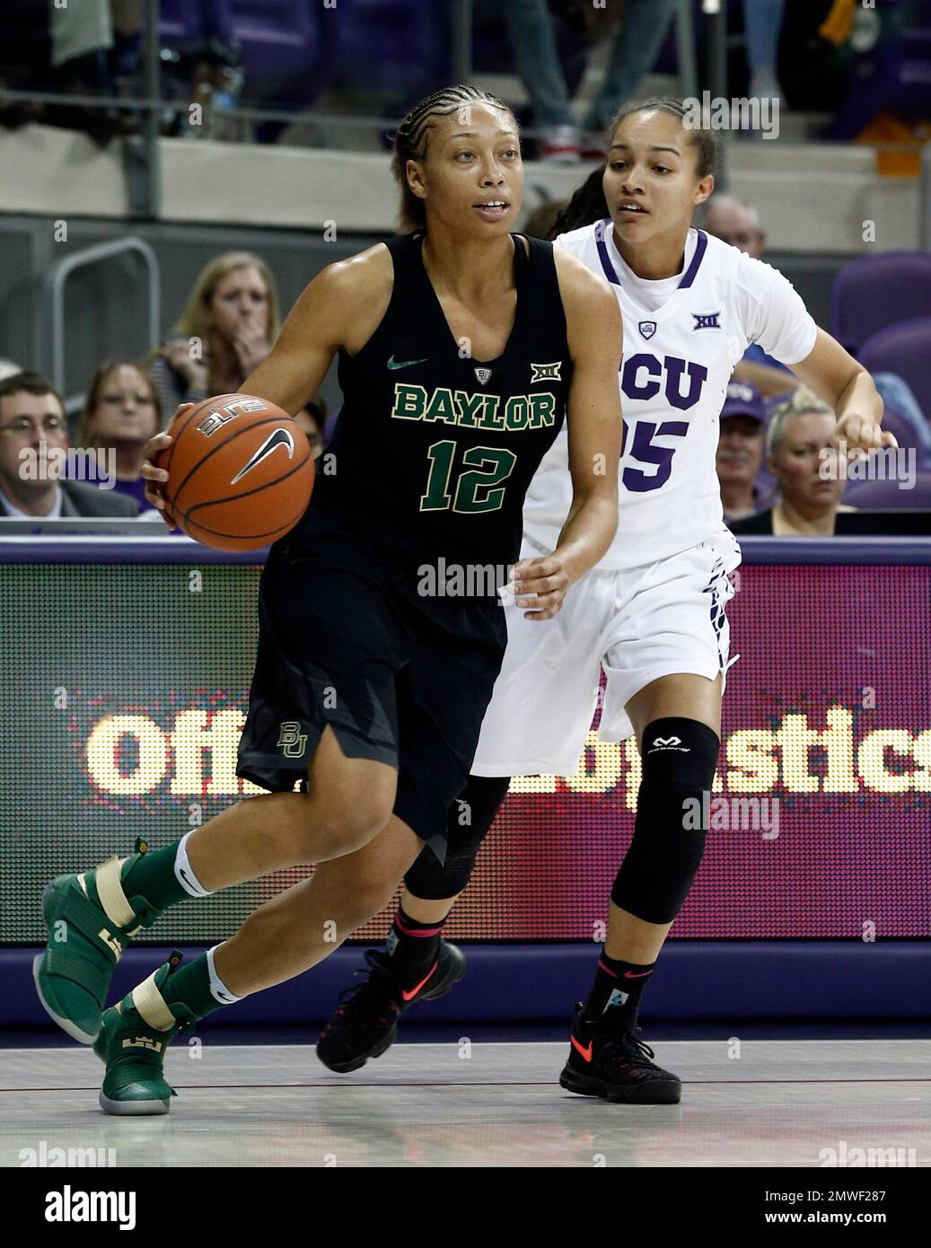 Baylor's Alexis Prince (12) drives past TCU's Kianna Ray (25) during ...